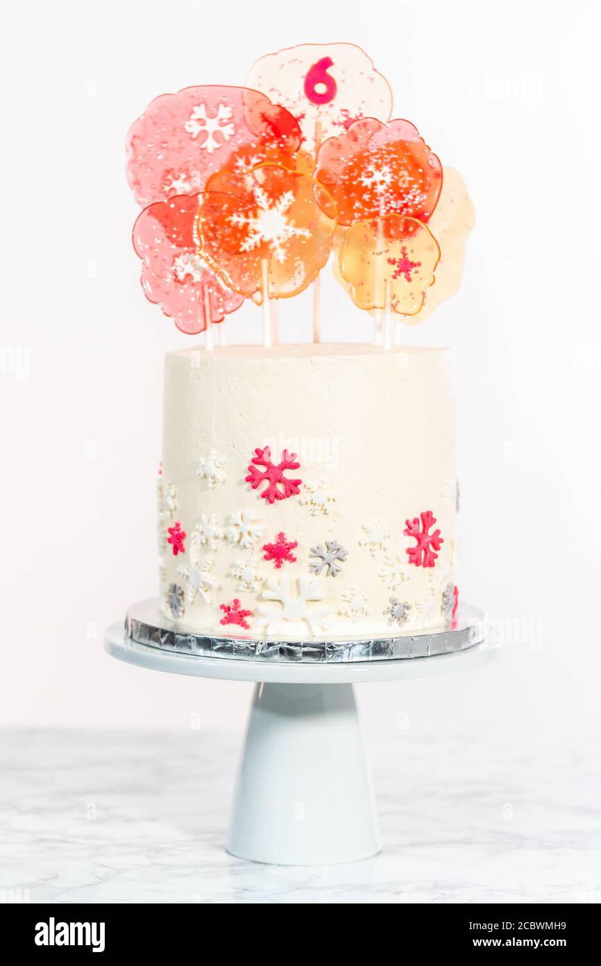 Tall round cake with Italian buttercream frosting decorated with ...