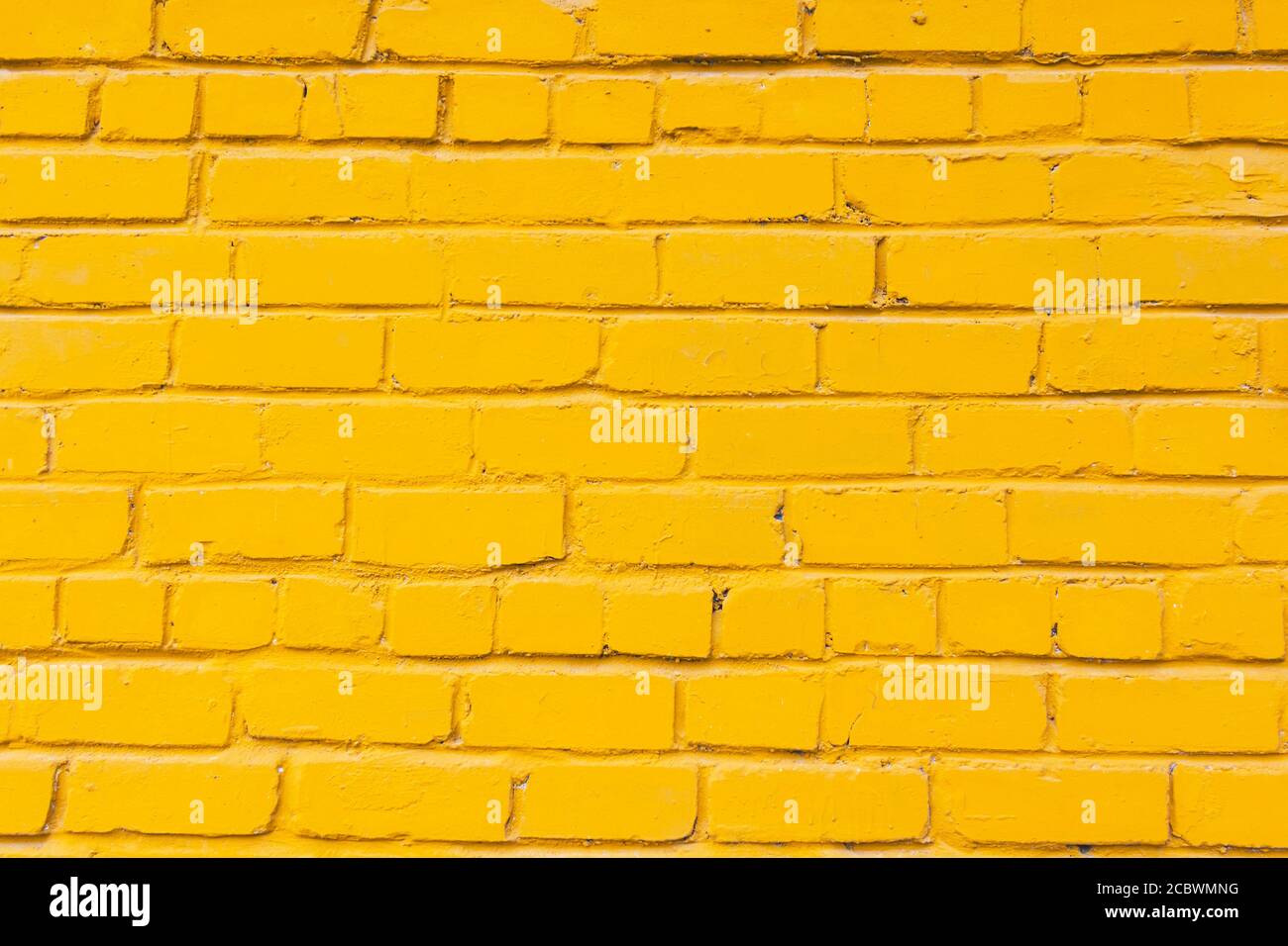 Background of yellow brick wall Stock Photo - Alamy
