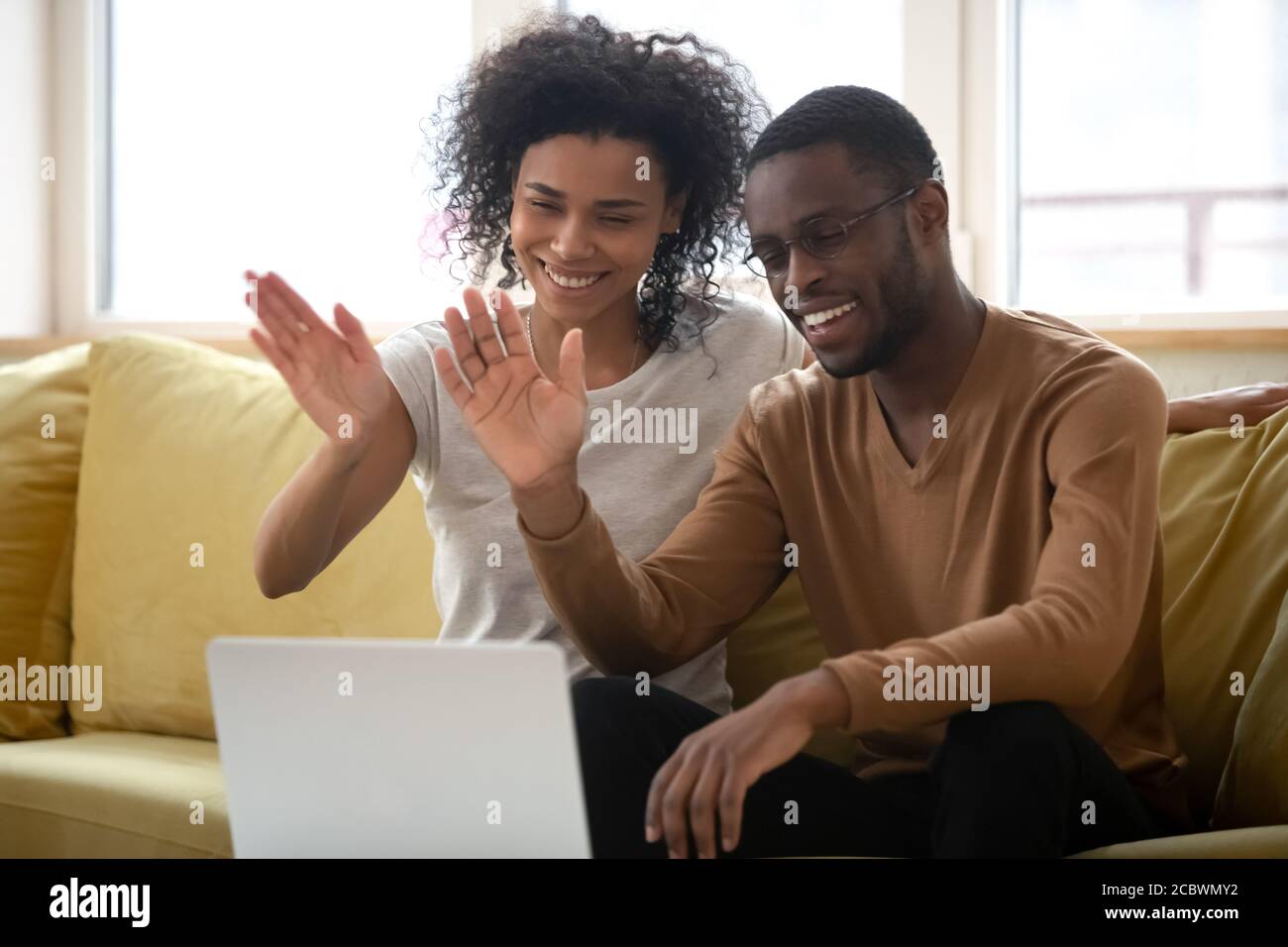 African american couple greeting making video conference call with ...