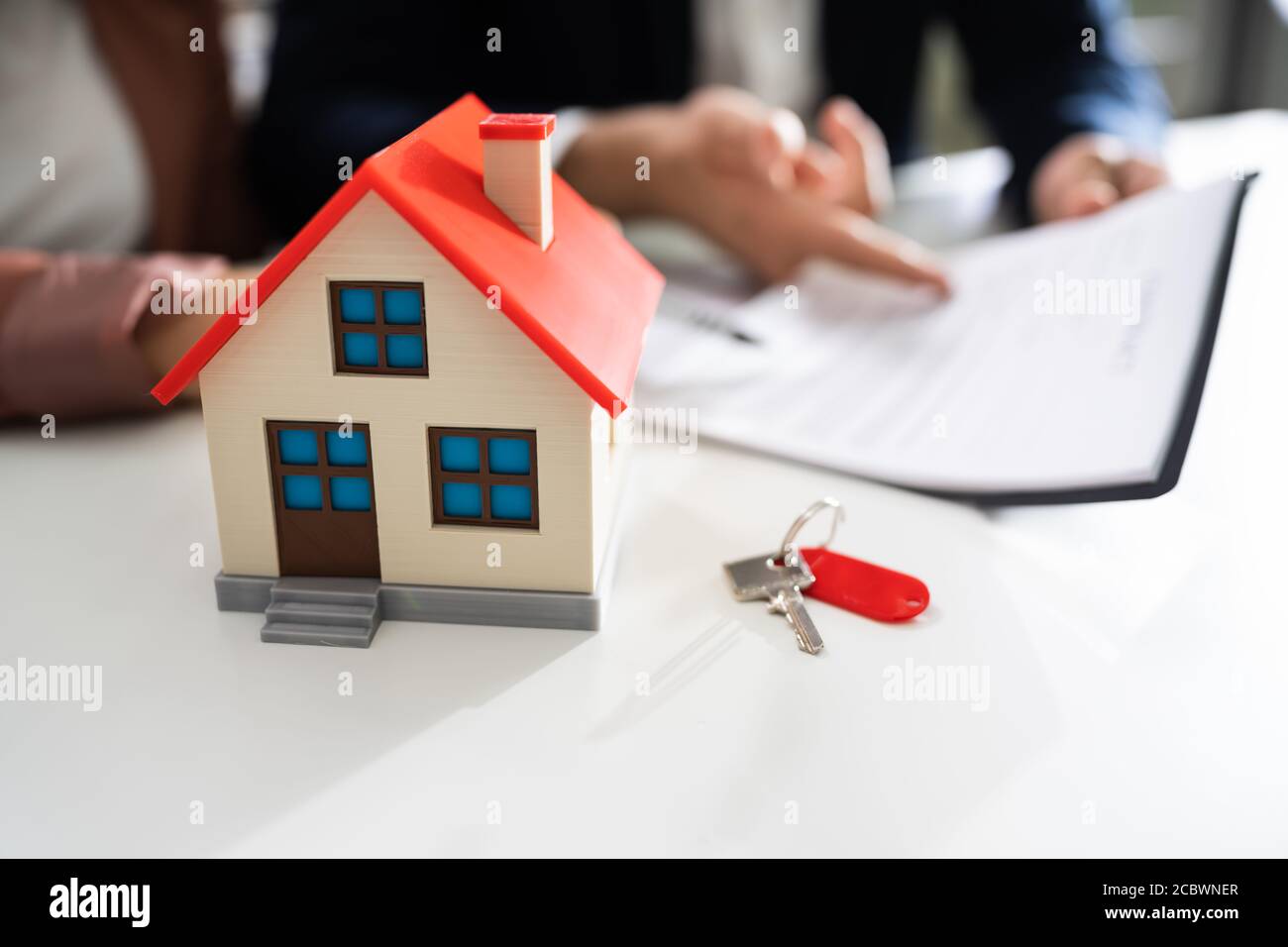 Real Estate Rent Contract Sign And House Key Stock Photo - Alamy