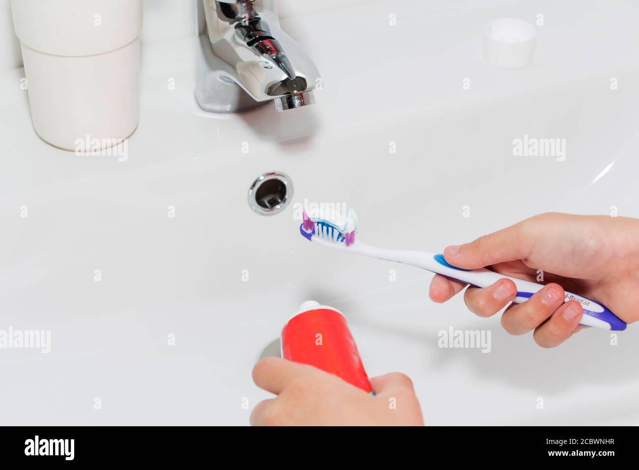 Toothpaste on a toothbrush, close-up. teeth care Stock Photo - Alamy