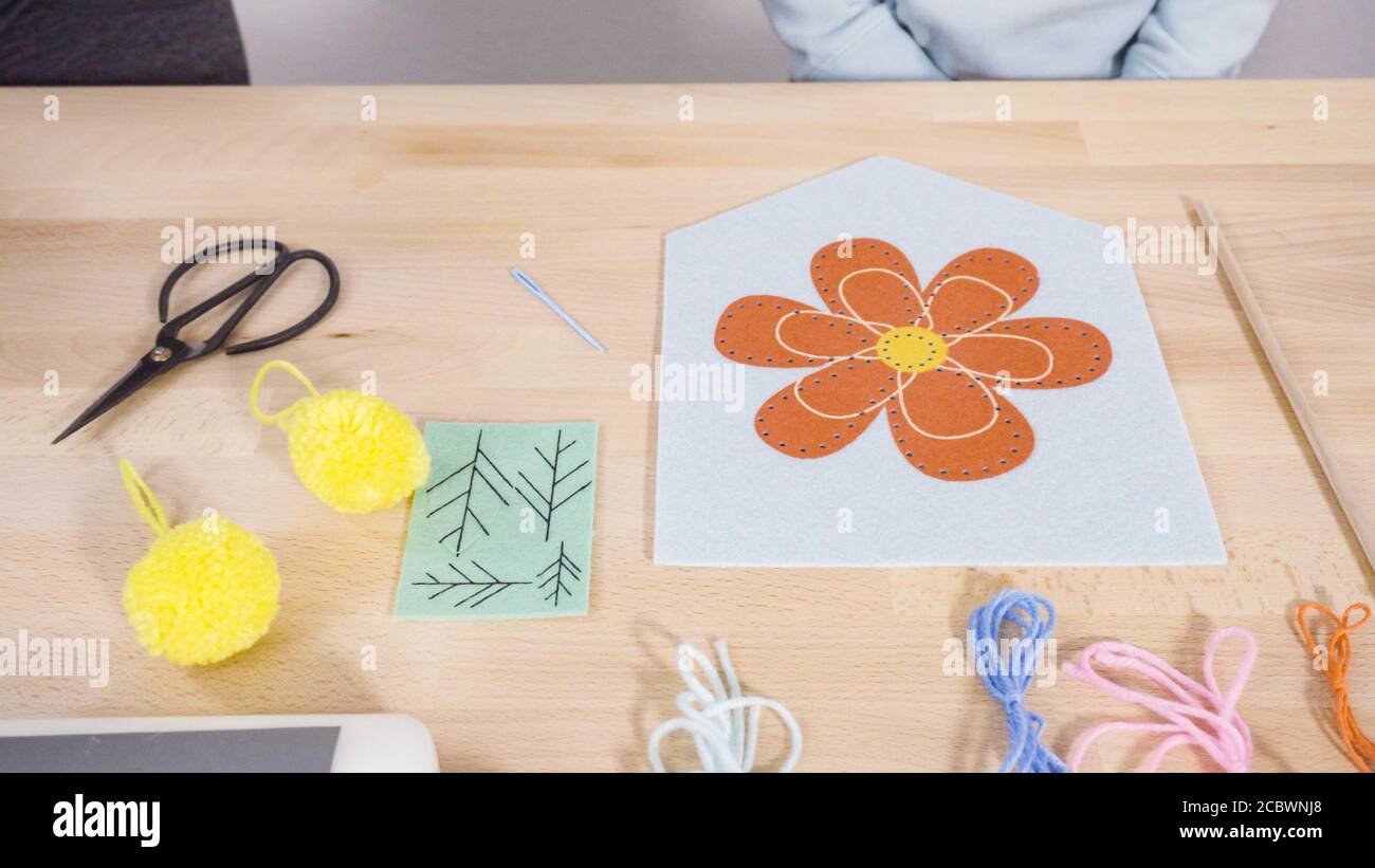 Mother teaching kids how to sew with simple sewing kit at the craft ...