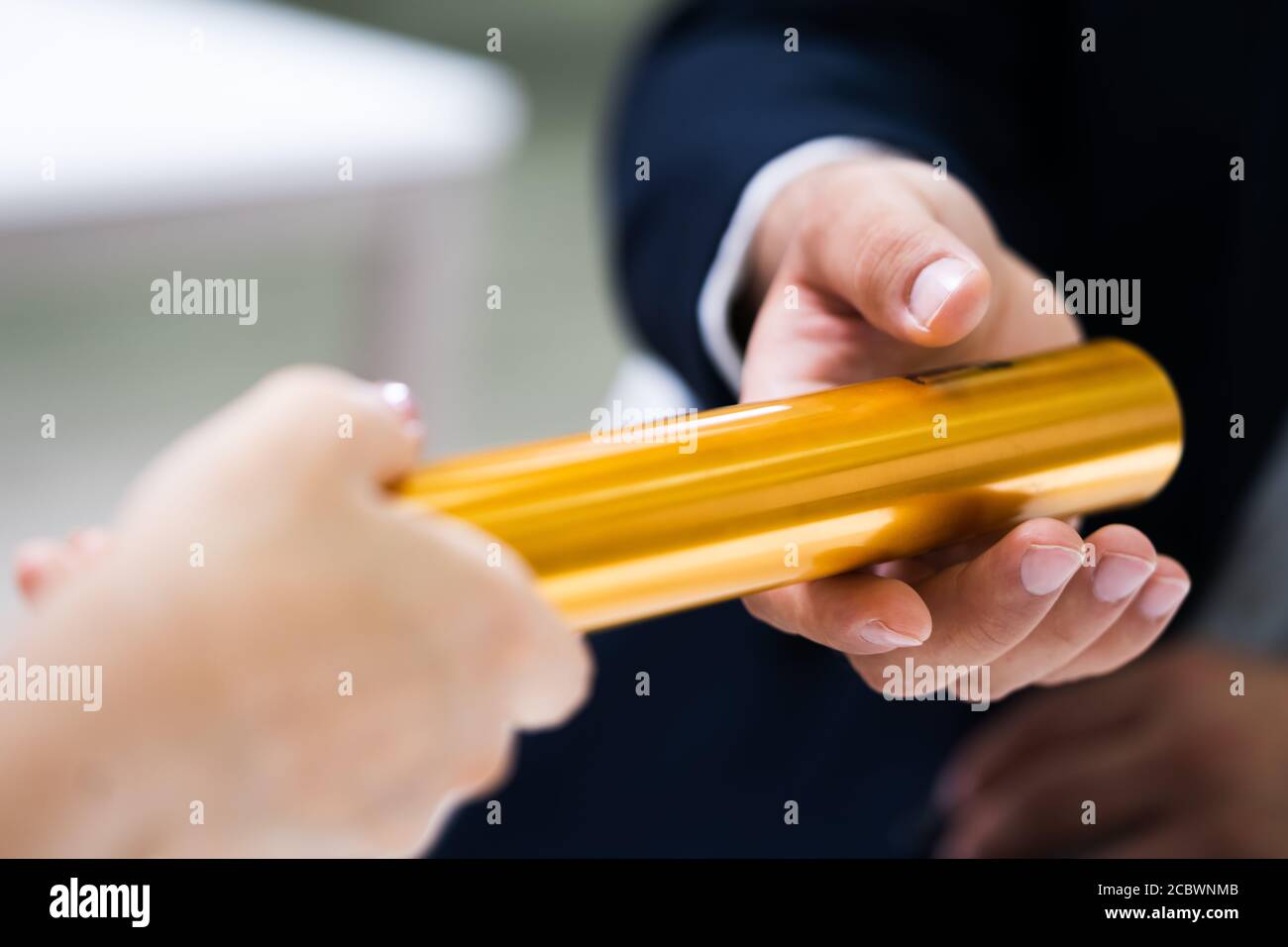 Business Man And Woman Relay Baton Handover And Pass Stock Photo - Alamy