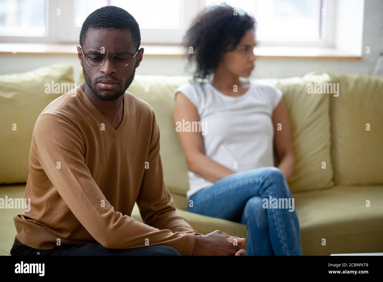 Sad angry african married couple ignoring each other after quarrel ...