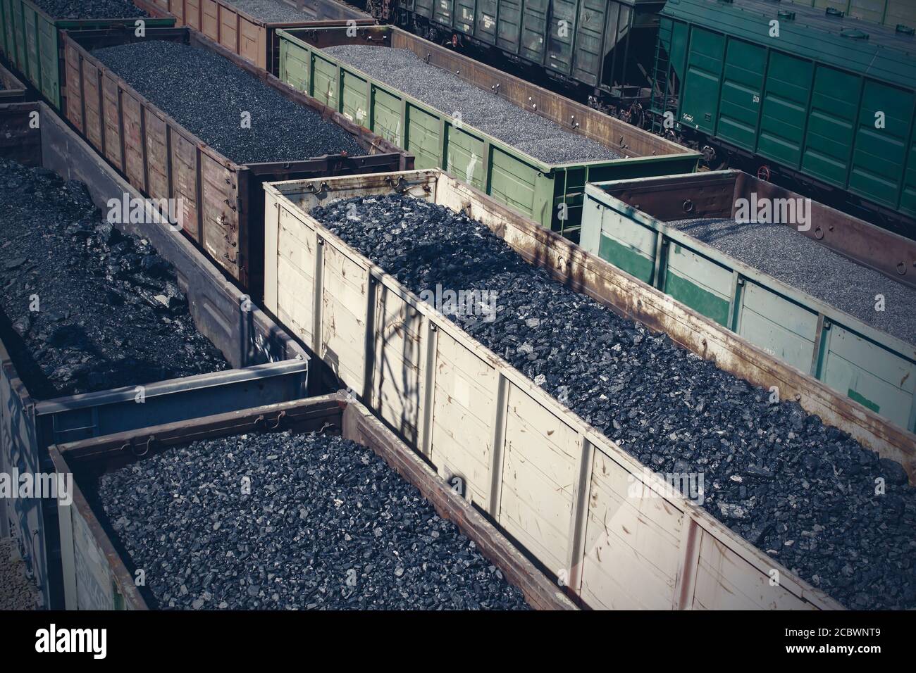 rail cars loaded with coal, a train transports coal Stock Photo - Alamy
