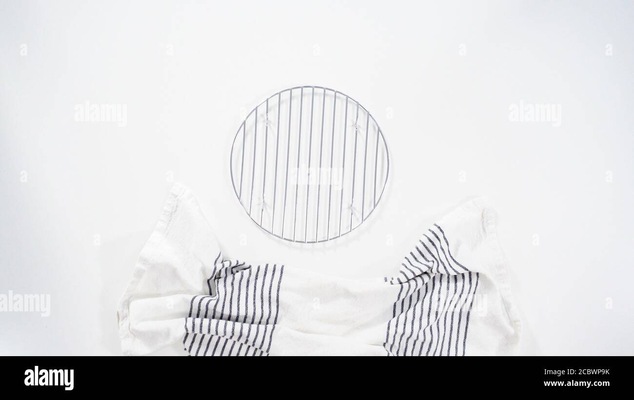 Flat lay. White and black kitchen towel on a white countertop Stock ...