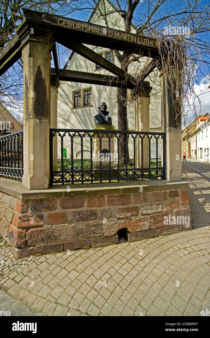 Germany, Eisleben. Bust of reformer Martin Luther in front of his birth ...