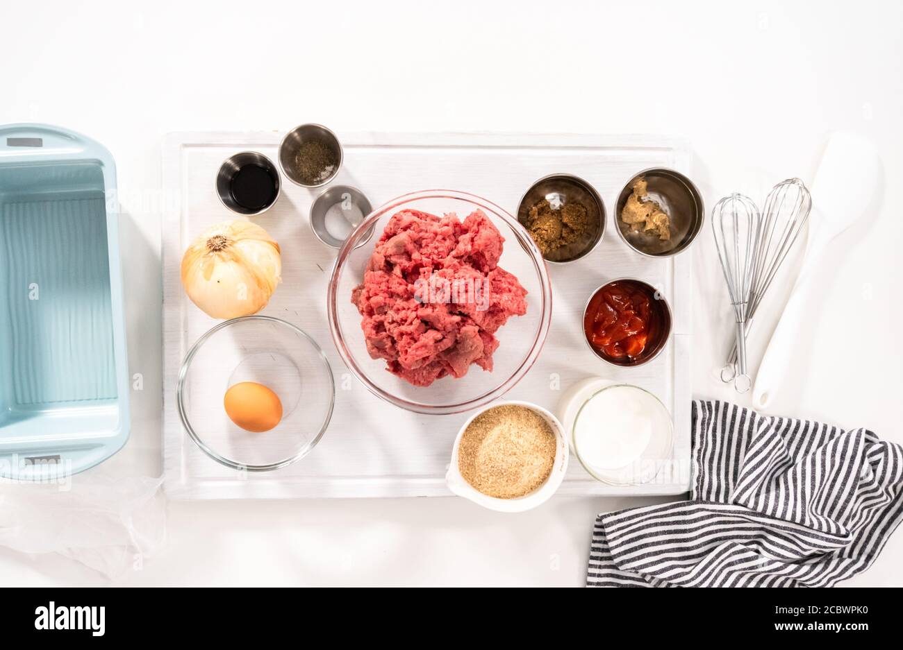Flat lay. Ingredients for preparing a classic beef meatloaf recipe ...