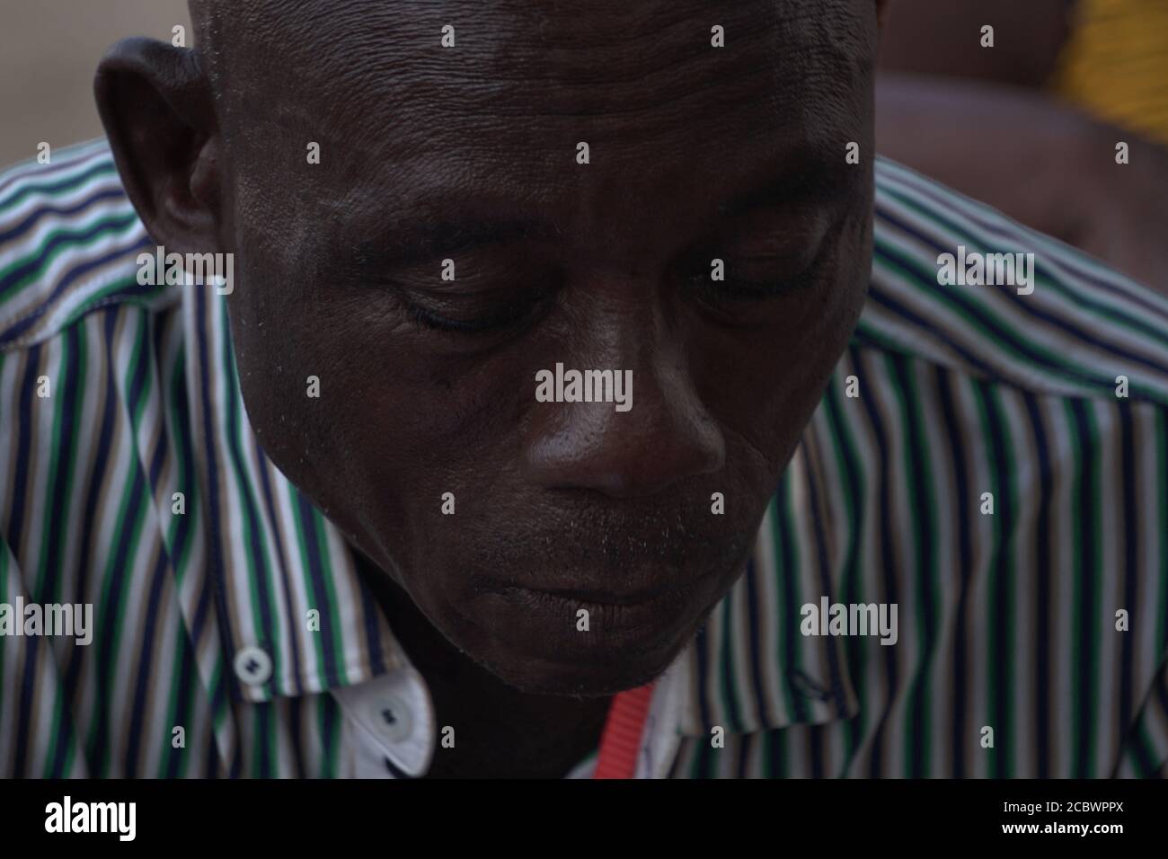 An congolease black man standing with baber Stock Photo - Alamy