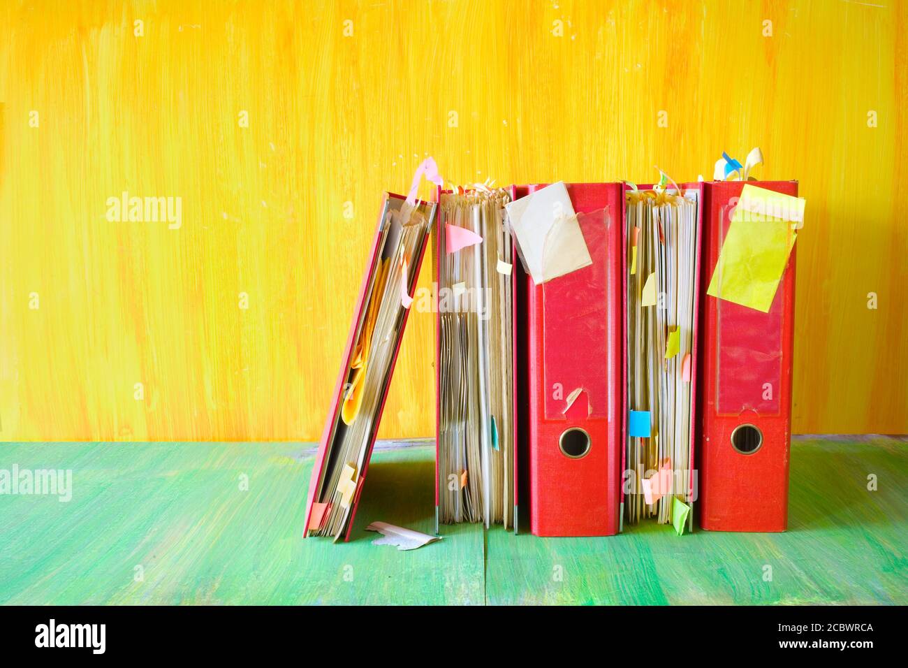 messy file folders and documents, bureaucracy and red tape concept ...