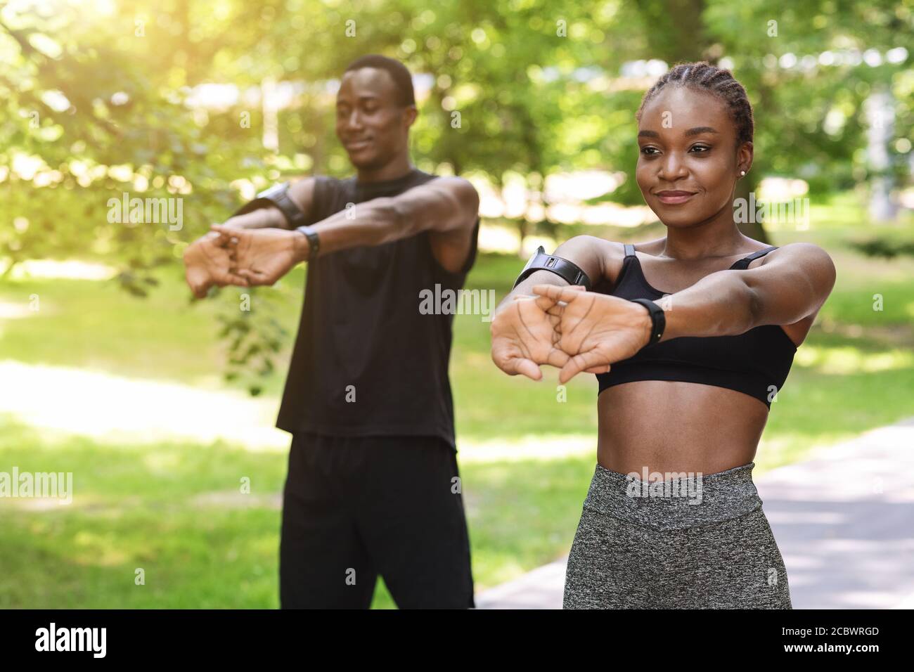 Healthy Lifestyle Concept. Black millennial couple doing sport outdoors ...