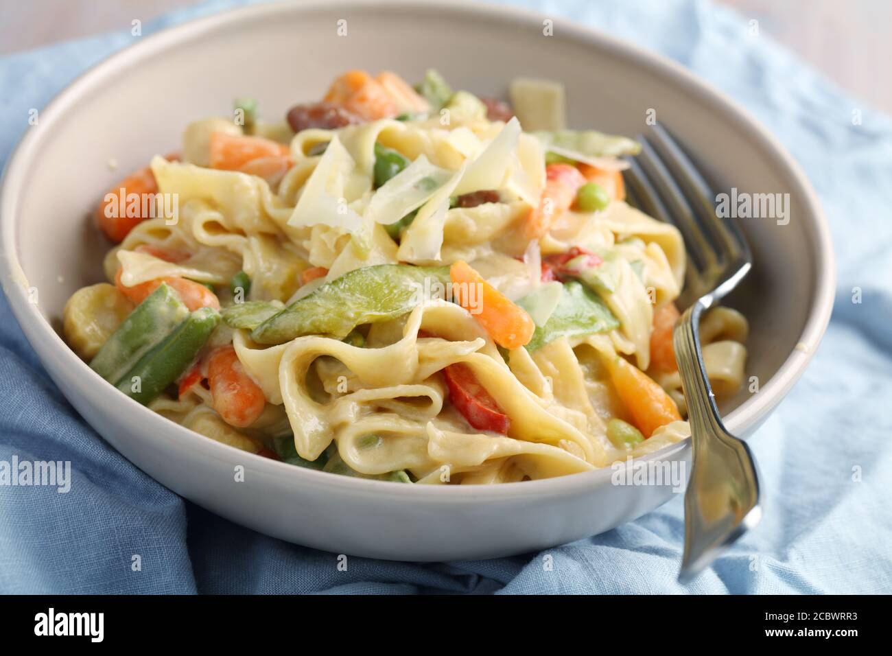 Spring Vegetable Fettuccine Alfredo with Parmesan cheese Stock Photo ...