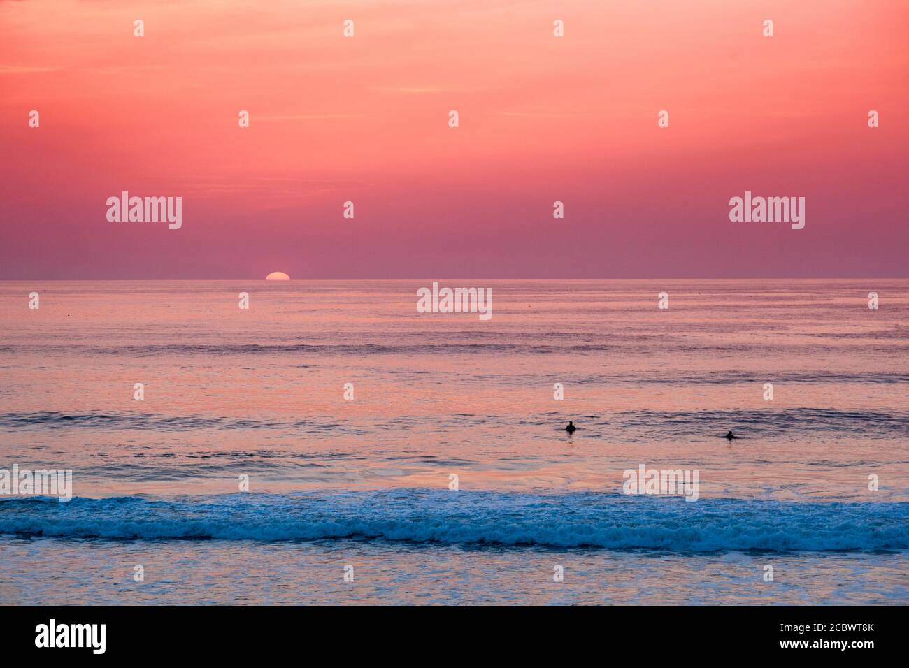 Swimming at sunset Stock Photo - Alamy