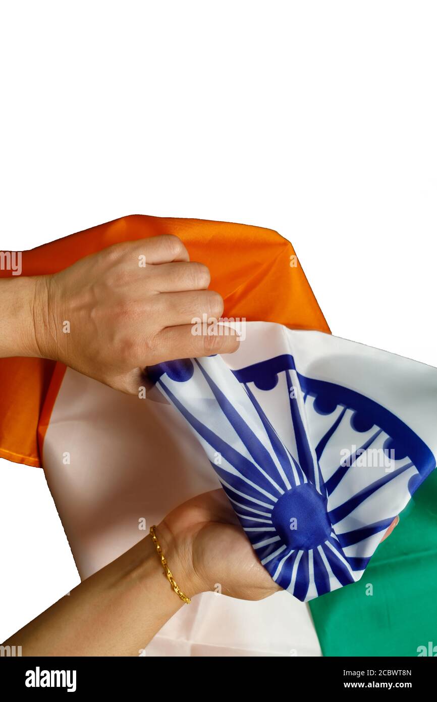 Top view of human hands holding a National Flag of India on white ...