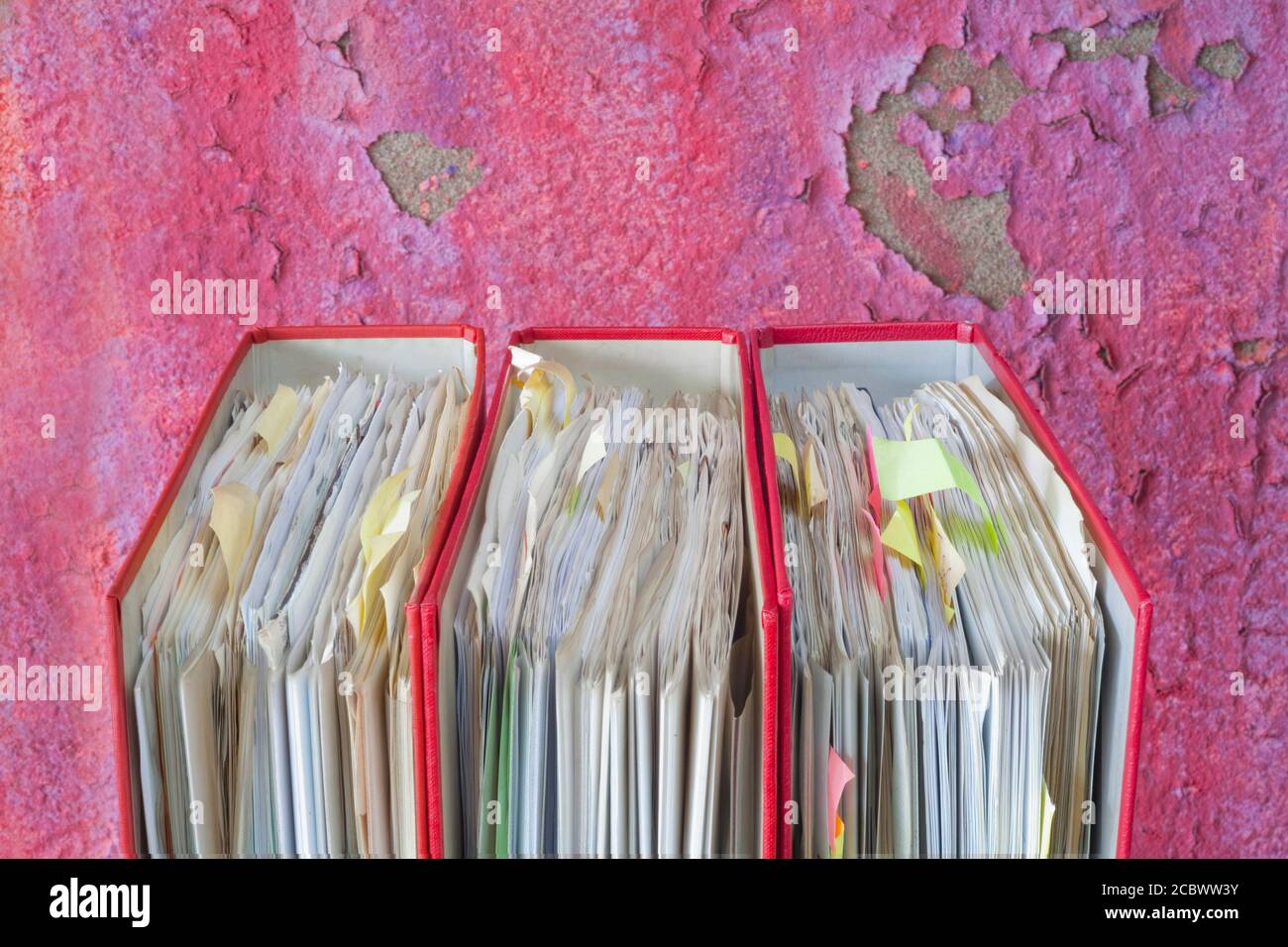 messy file folders and documents, bureaucracy and red tape concept ...