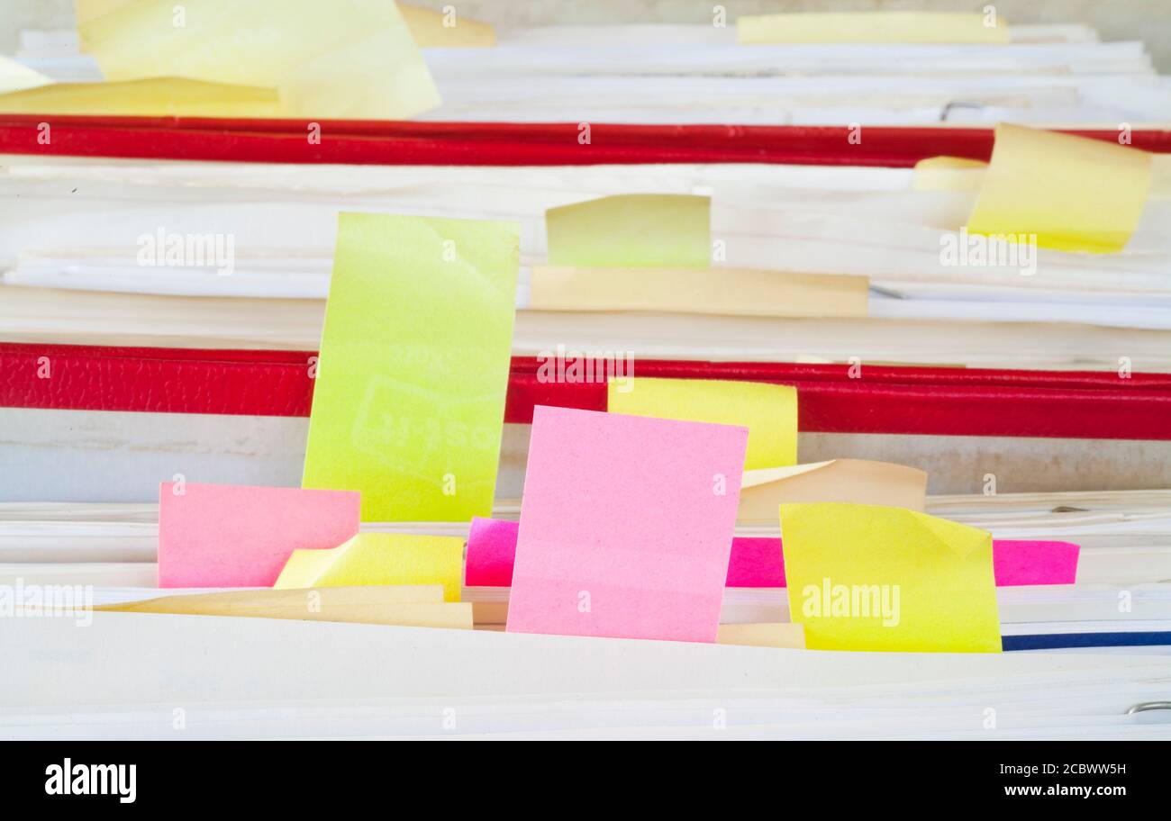 messy file folders and documents, bureaucracy and red tape concept ...