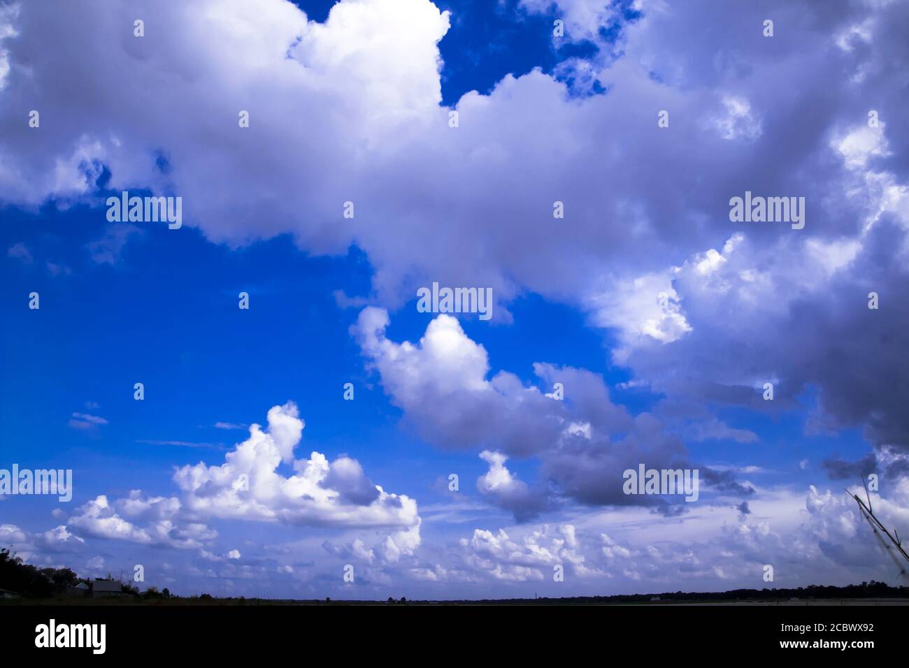 Blue sky background with clouds Stock Photo - Alamy