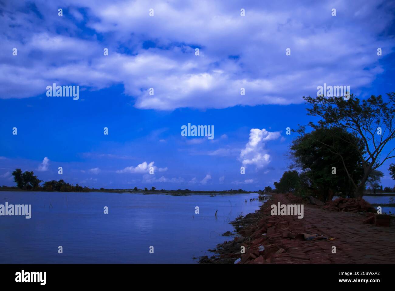 Blue sky background with clouds Stock Photo - Alamy