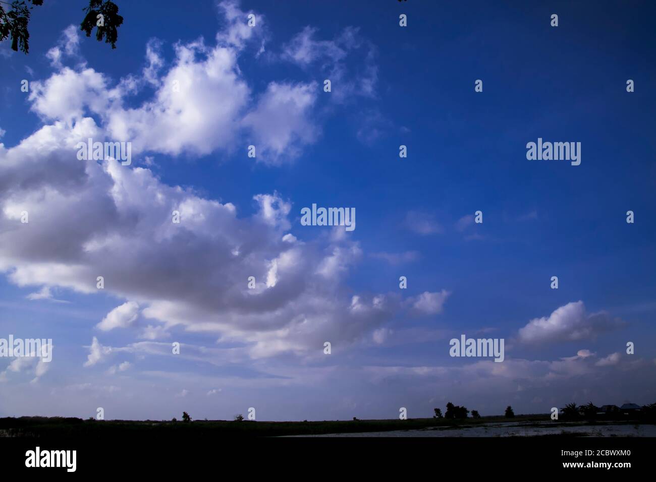Blue sky background with clouds Stock Photo - Alamy