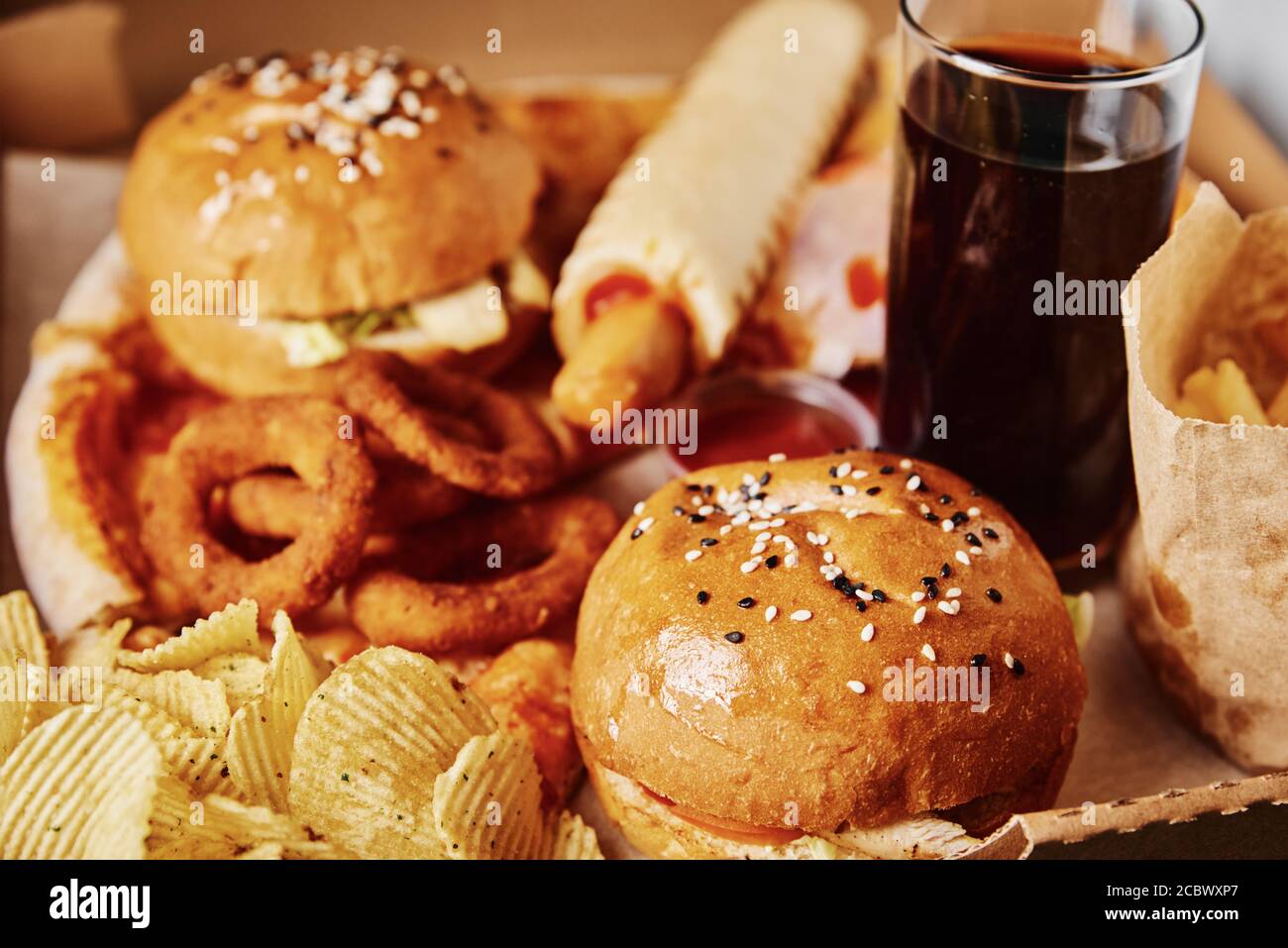 Unhealthy and junk food. Different types of fast food on the table ...