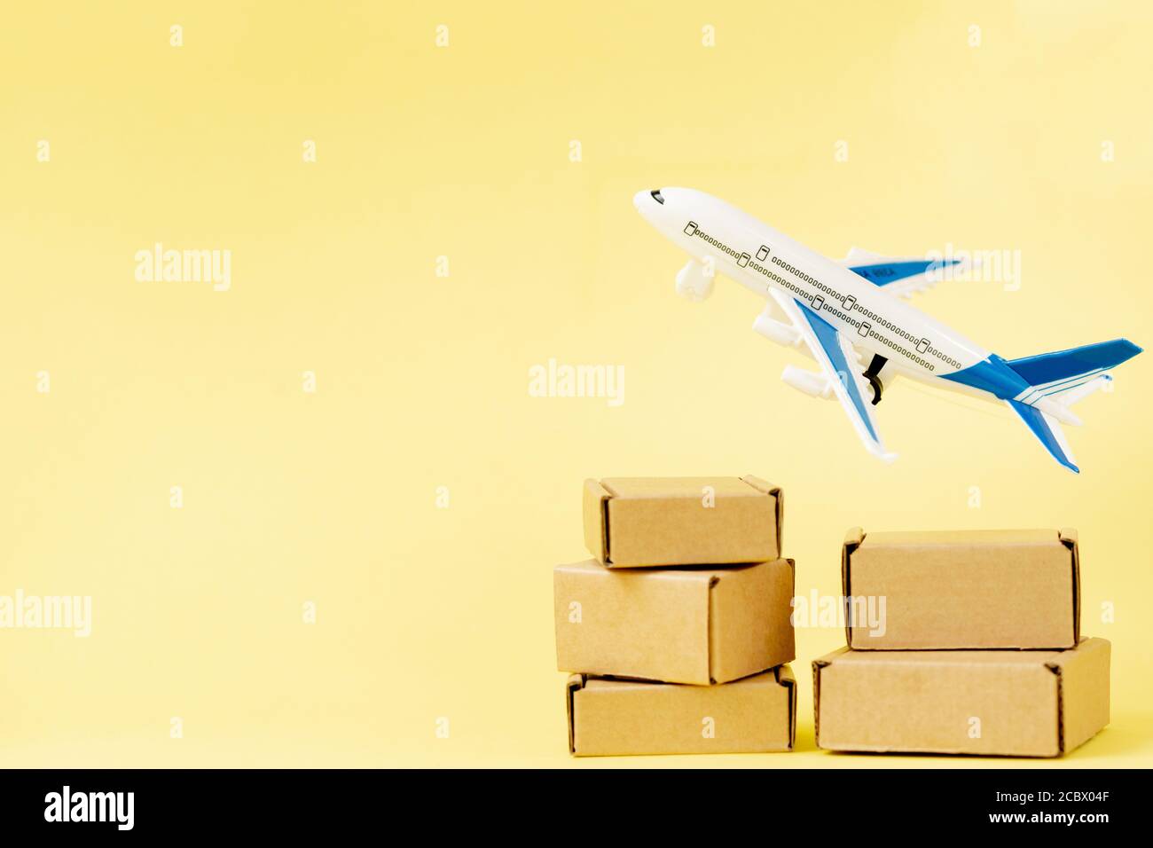 Airplane and stack of cardboard boxes. concept of air cargo and parcels ...