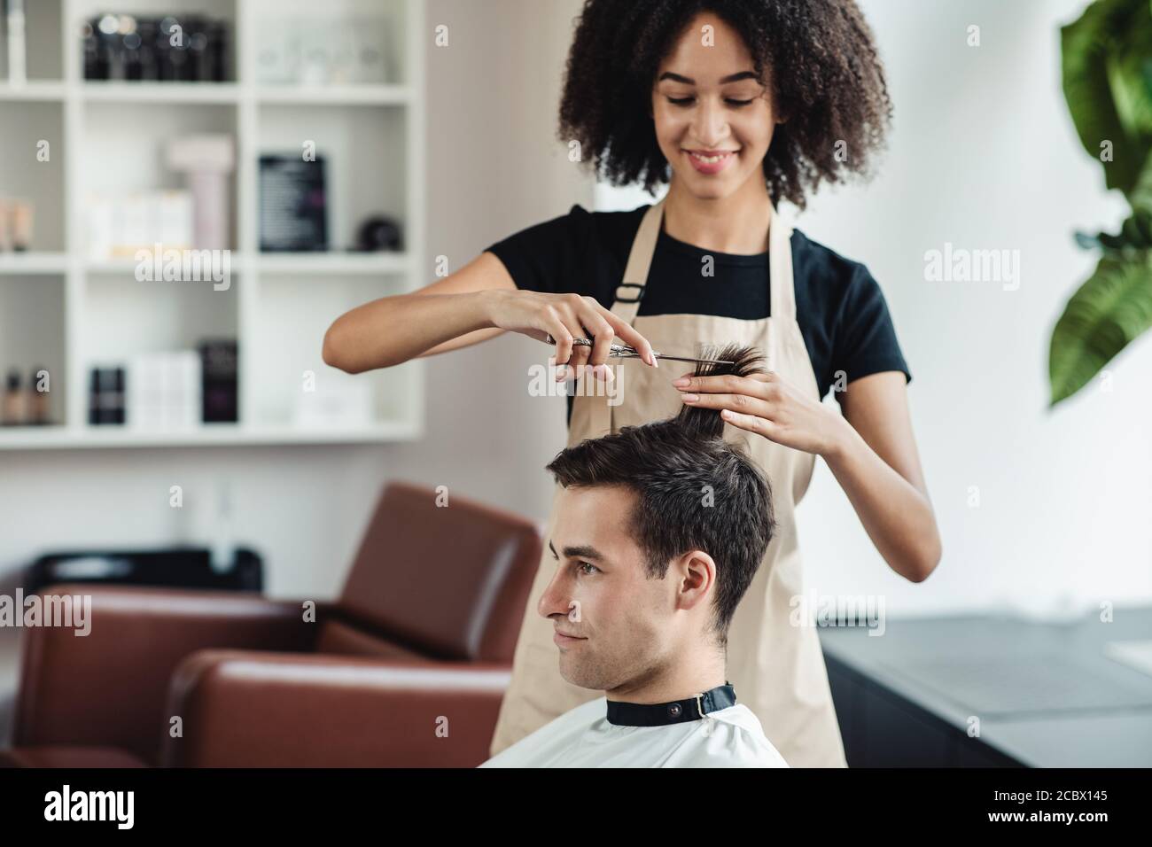 Woman getting her hair cut hi-res stock photography and images - Alamy