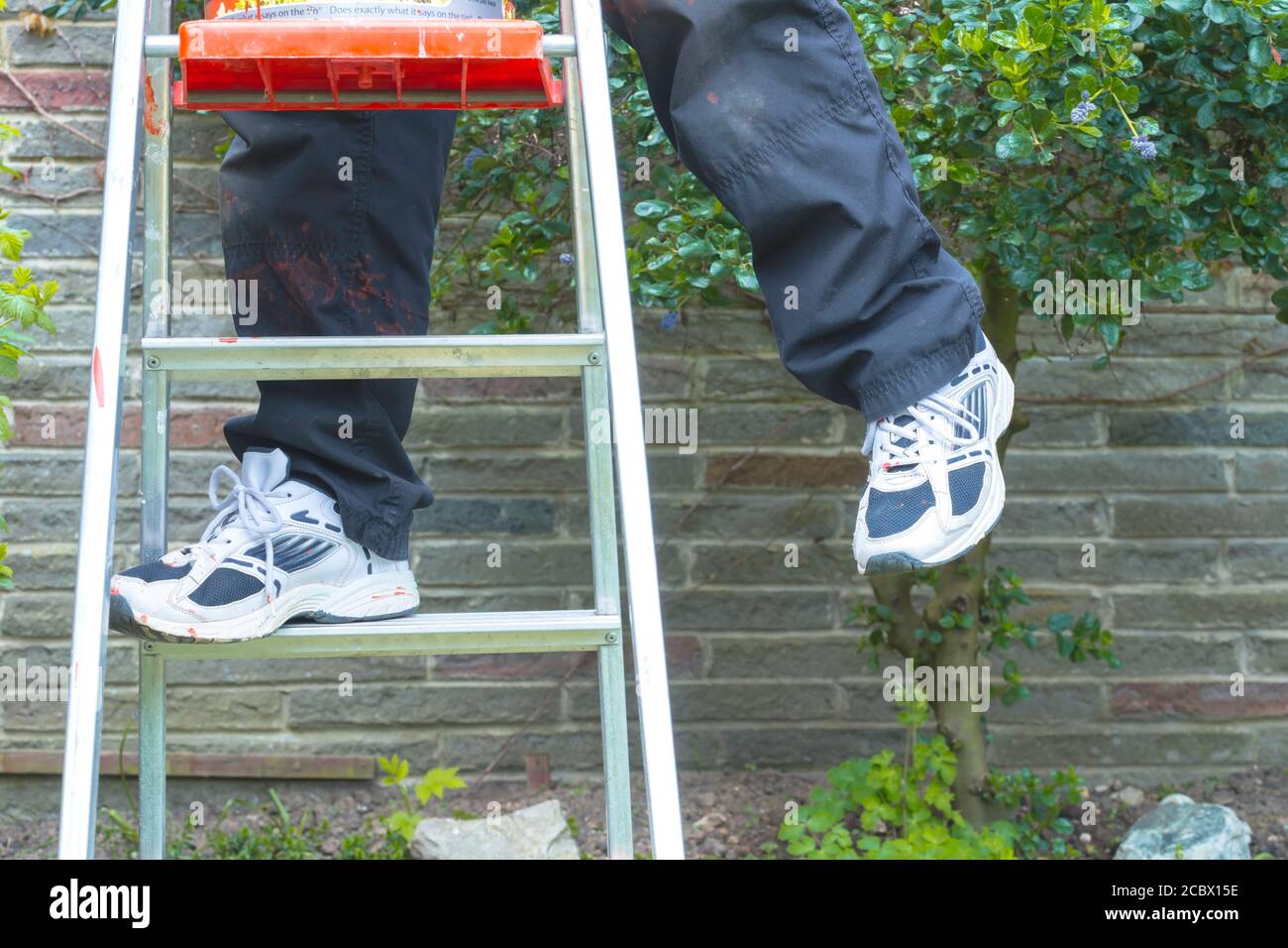 Two men on ladder one hi-res stock photography and images - Alamy