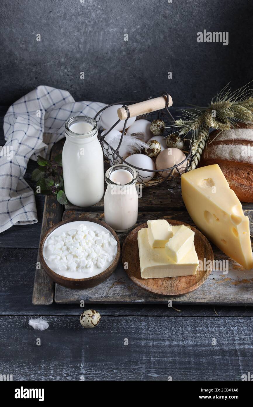 dairy products assortment on wooden board Stock Photo - Alamy