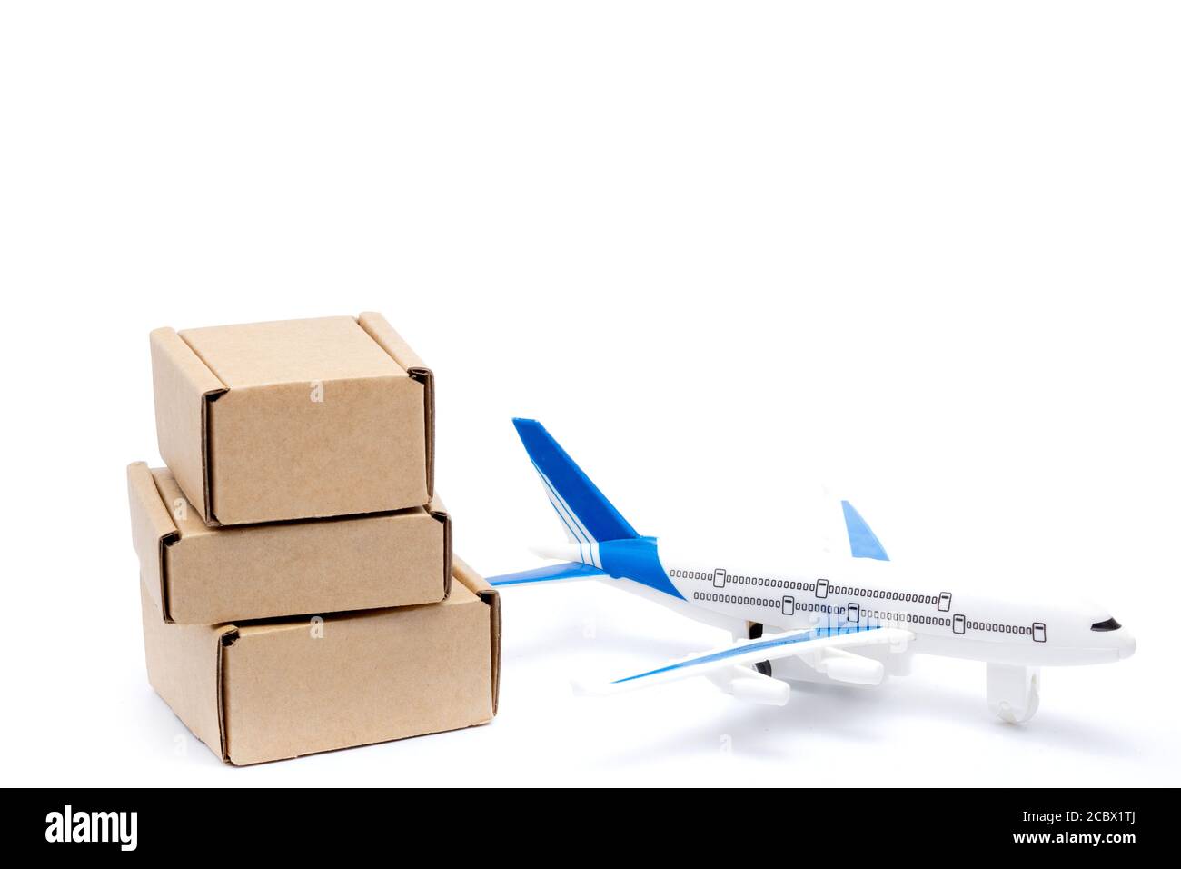 Shadow Airplane and stack of cardboard boxes isolated on white ...