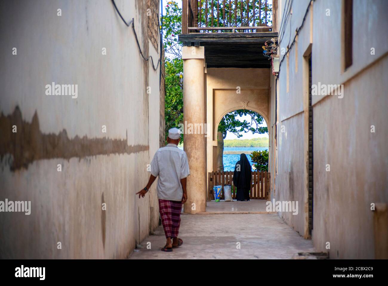 Local people in a narrow street of Lamu town in Lamu Island, Kenya ...