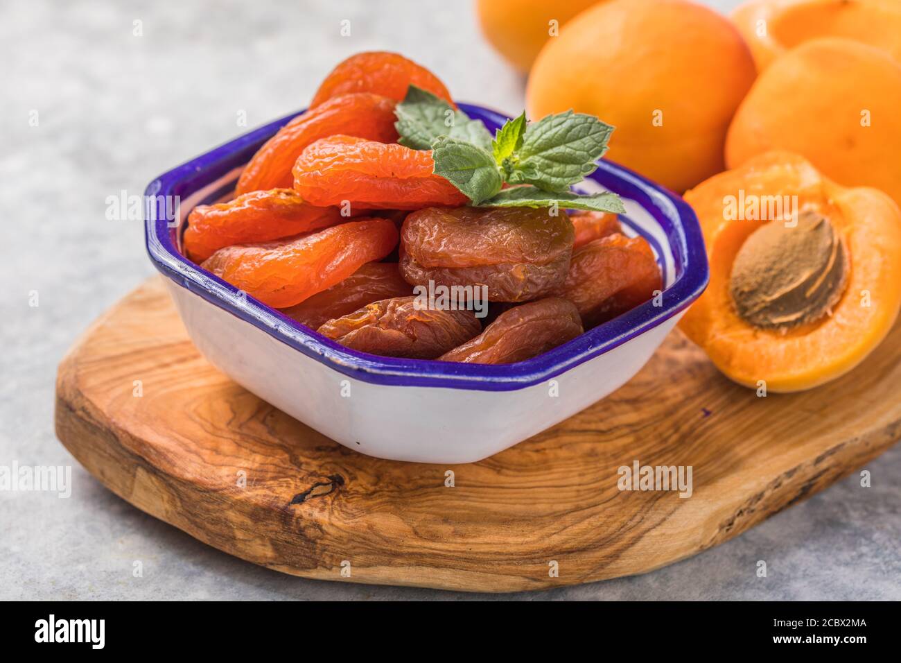 Pile of sun dried apricots on stone background Stock Photo - Alamy
