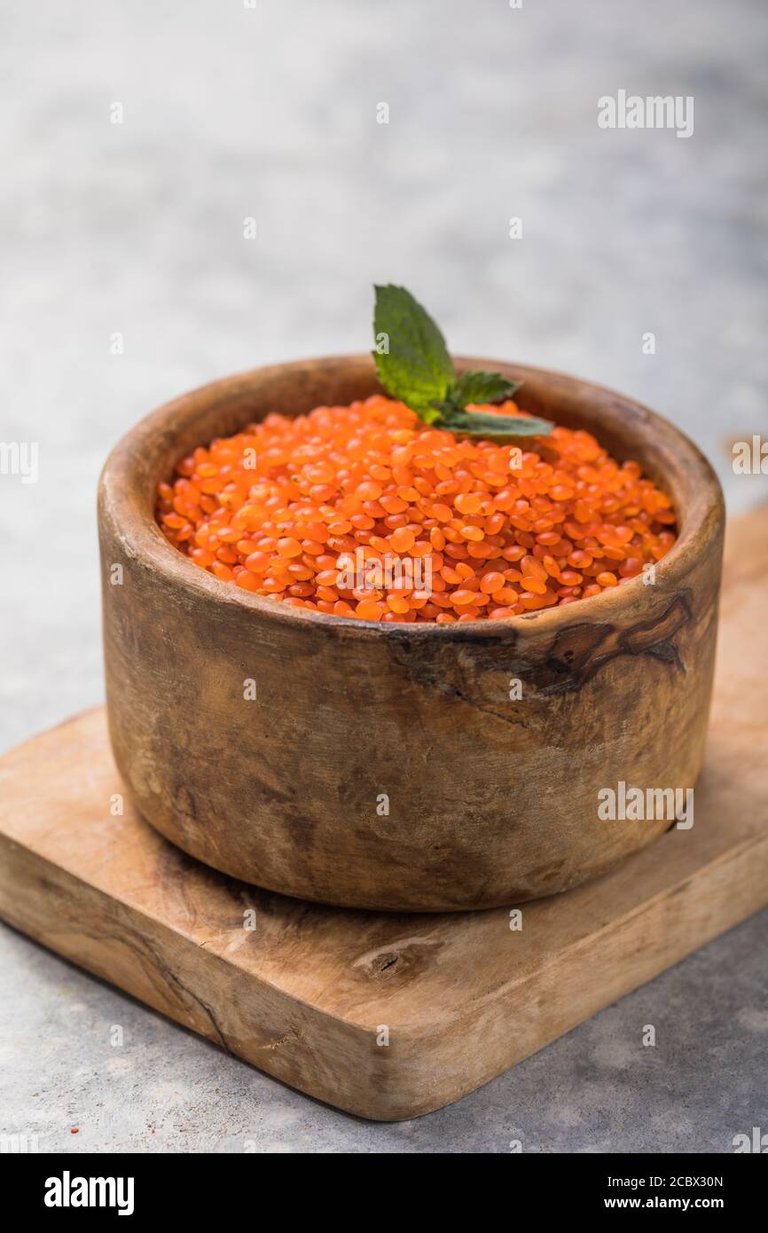 Red Lentil whole grain in a wooden bowl Stock Photo - Alamy