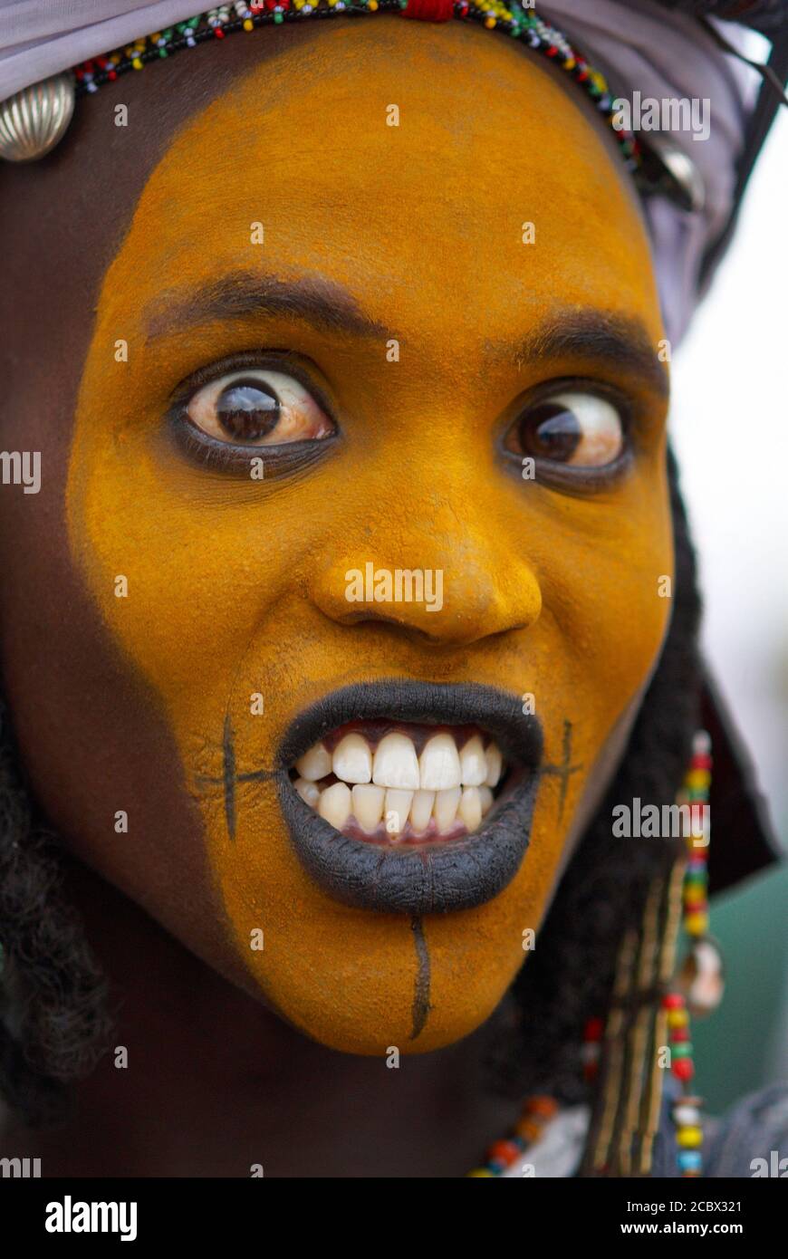 Niger. A Wodaabe-Bororo man with his face painted for the annual ...