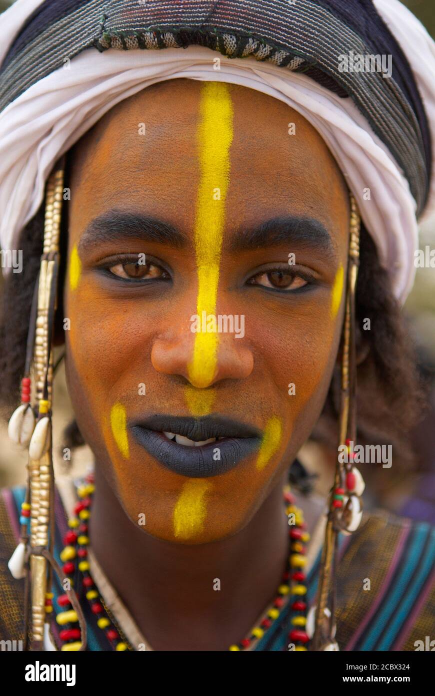 Niger. A Wodaabe-Bororo man with his face painted for the annual ...