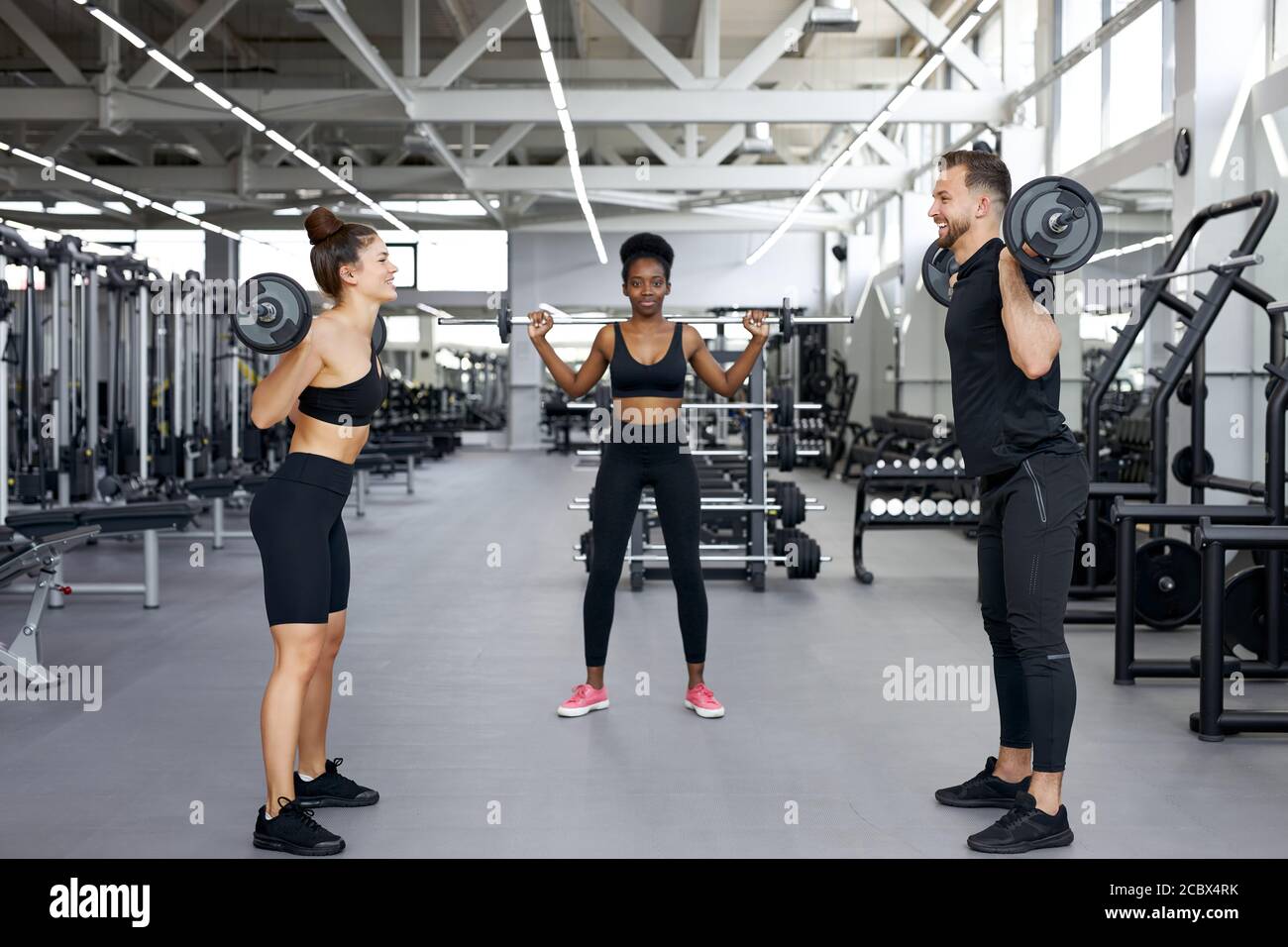 professional sportsman teach girls to pump muscles with the use of ...