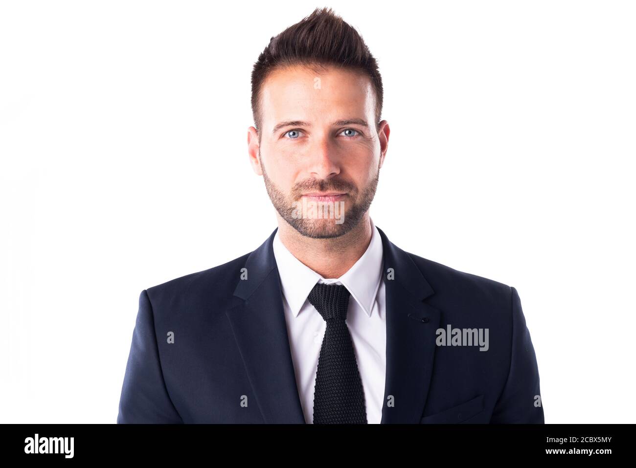 Handsome businessman portrait while standing at isolated white ...