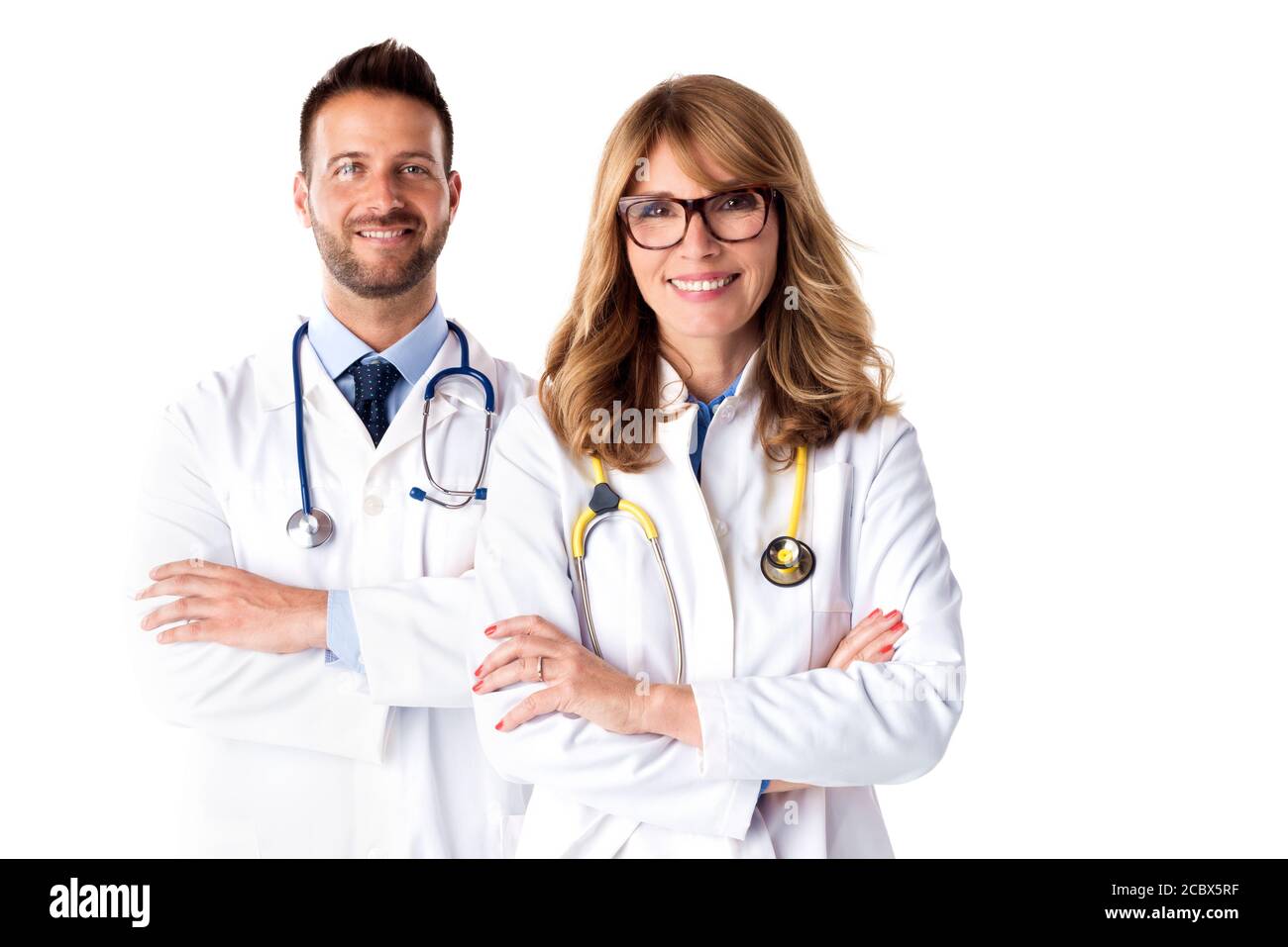 Shot of female and male doctors standing together at isolated white ...