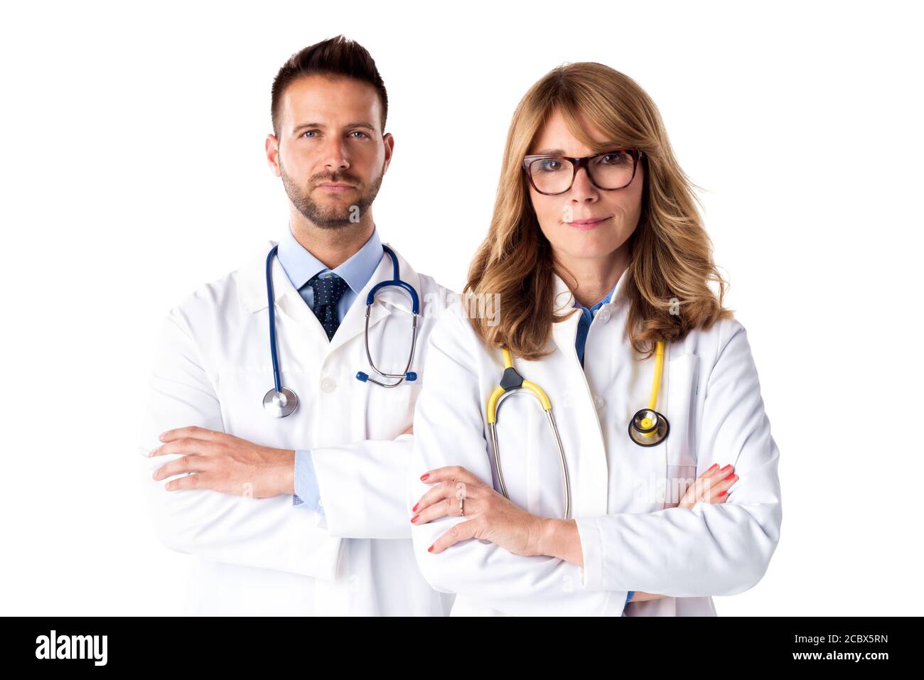 Shot of female and male doctors standing together at isolated white ...