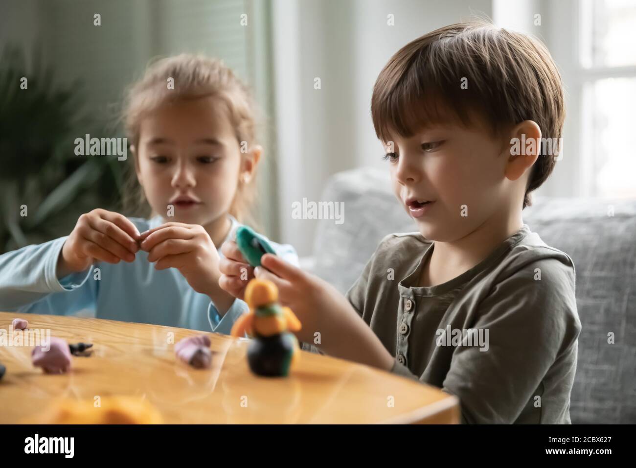 Happy cute small children siblings involved in handmade activity Stock ...