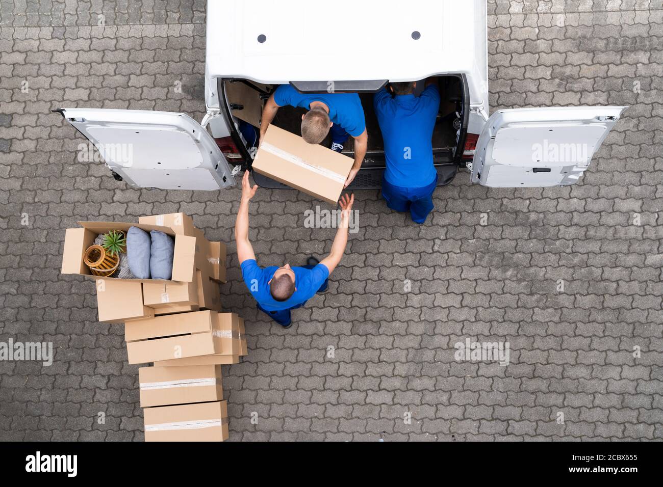 Open Truck Delivery. Mover Men Moving Boxes Stock Photo - Alamy