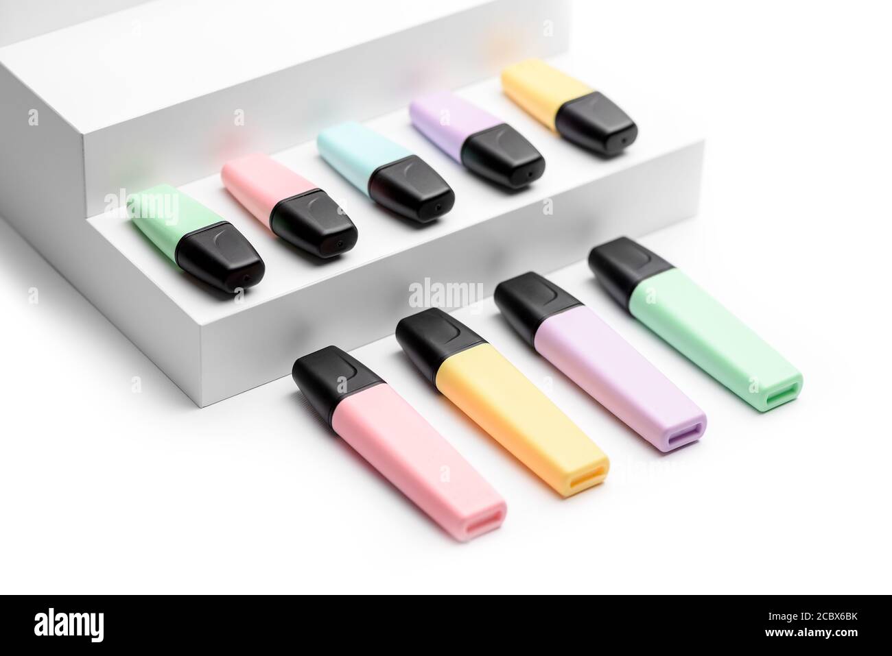 9 Pastel highlighters on white background side view Stock Photo - Alamy