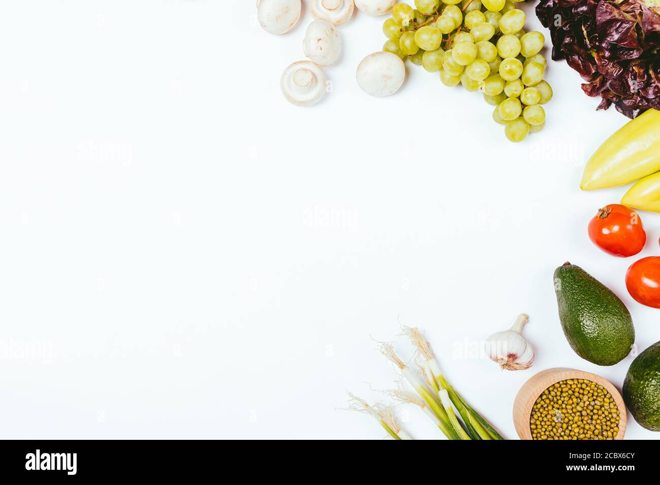 Clean eating background fresh vegetables and fruits on white table with ...