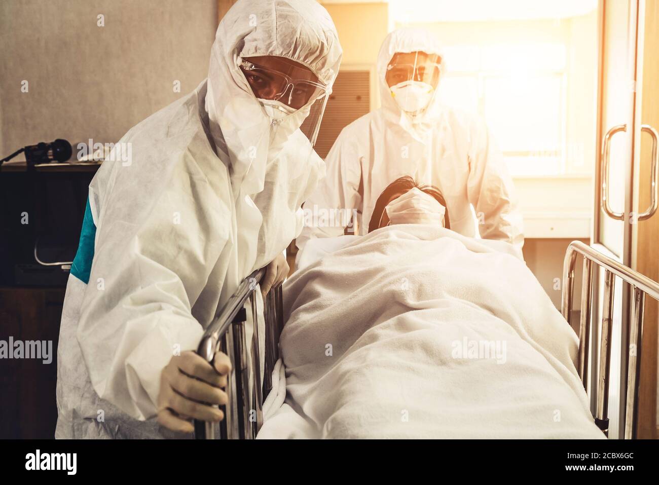 Emergency medic and doctor moving patient to emergency room Stock Photo ...