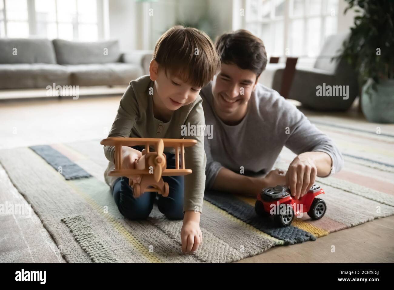 Happy little adorable kid boy playing toys with father Stock Photo - Alamy