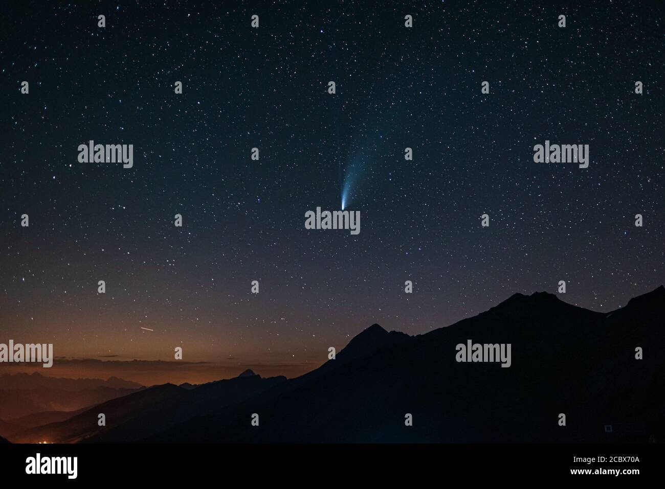 comet Neowise twin tails glowing in the night sky. Telephoto view ...
