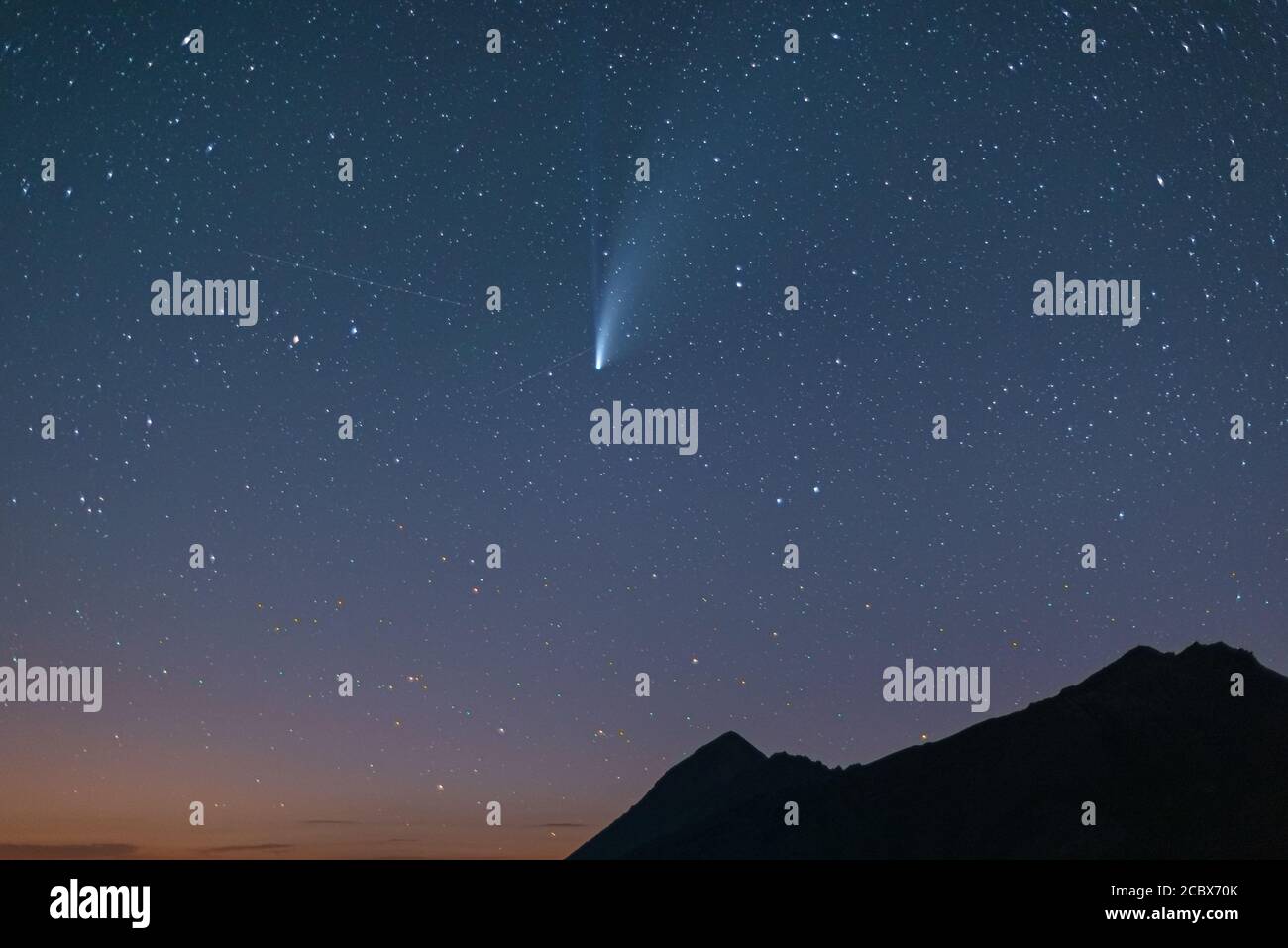 comet Neowise twin tails glowing in the night sky. Telephoto view ...