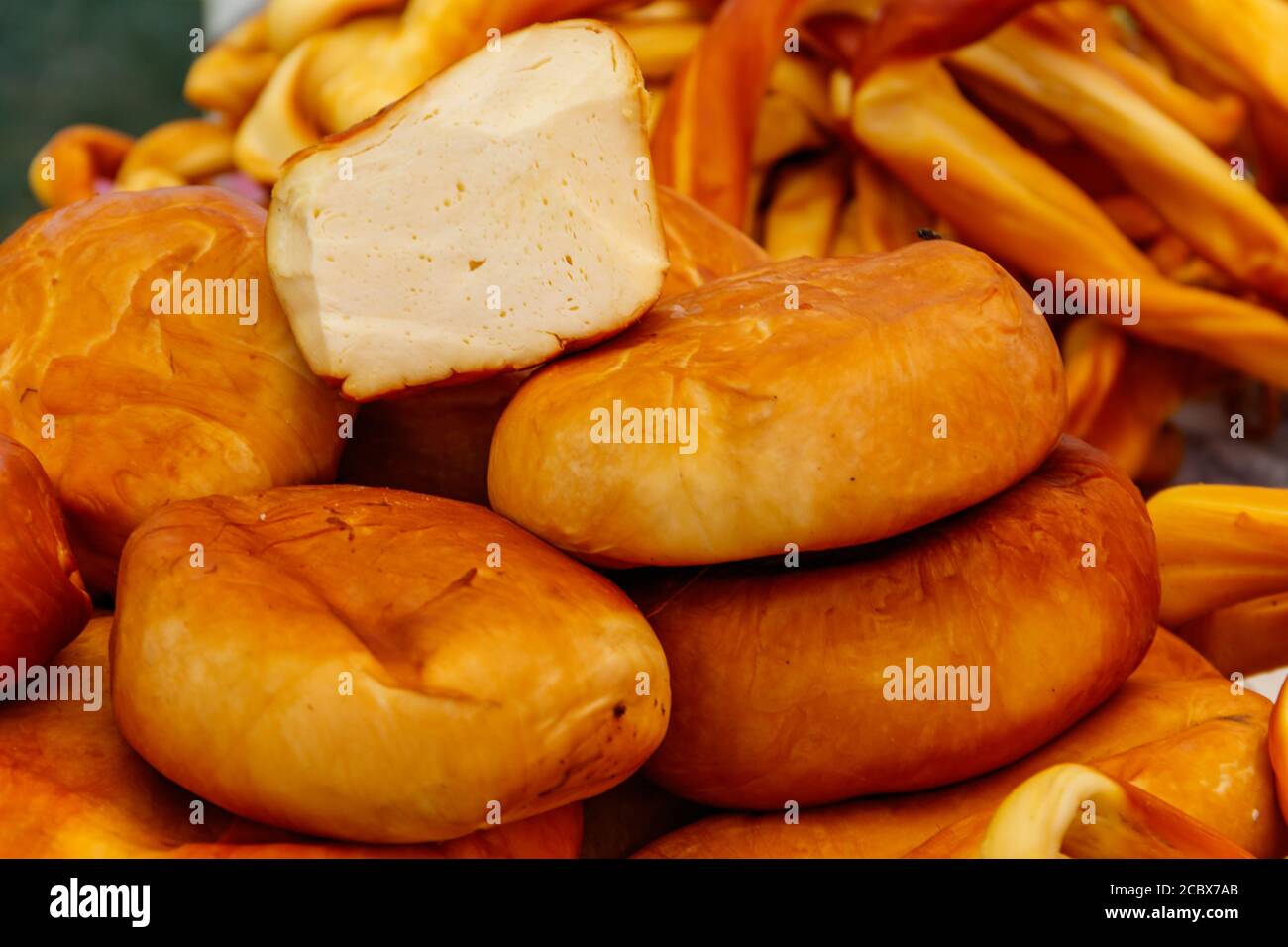 Different kinds of smoked cheese on a table Stock Photo - Alamy