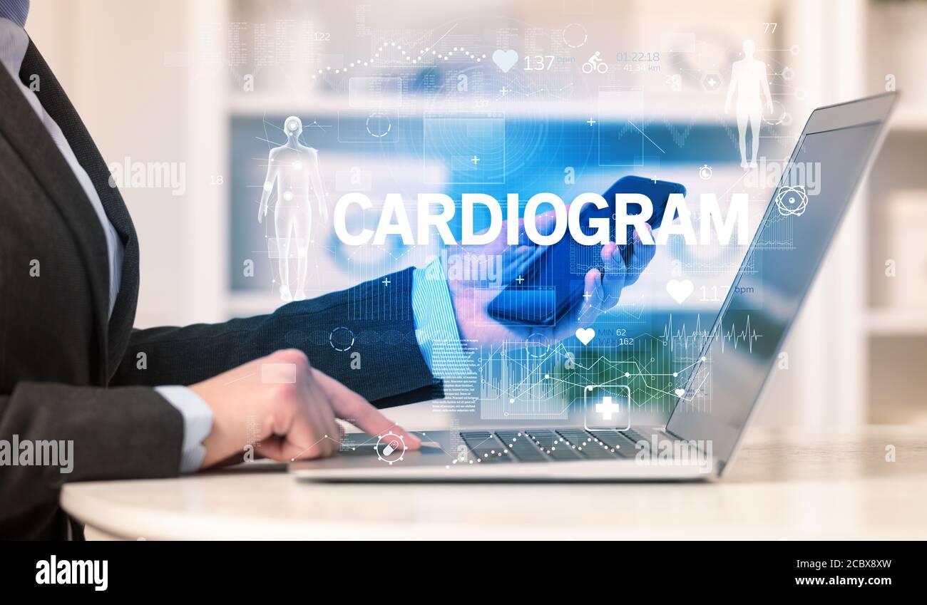 Doctor working a health check with CARDIOGRAM inscription, recording ...