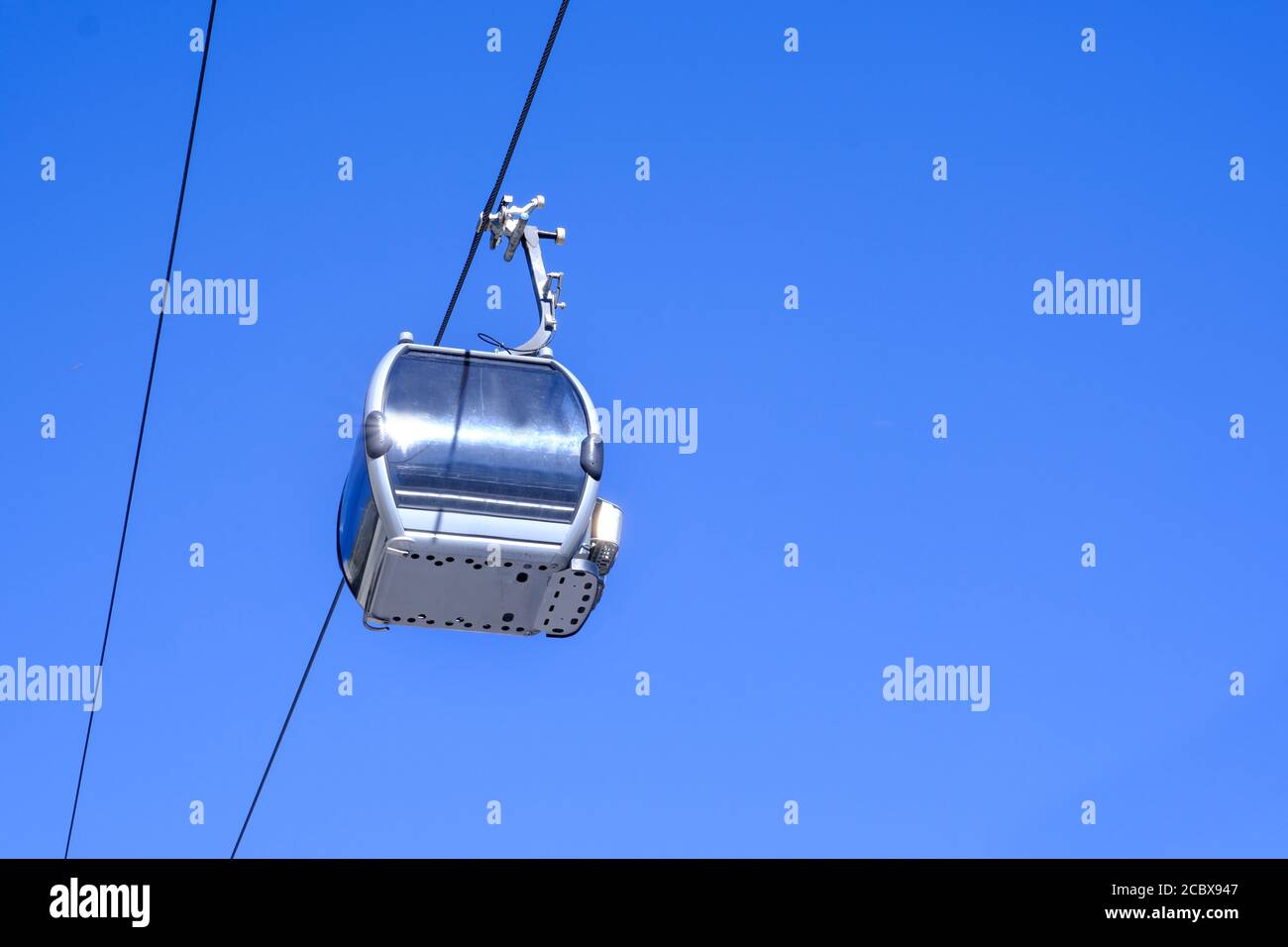 Cable car lift cabin on against blue sky. Funicular or cable cars in ...