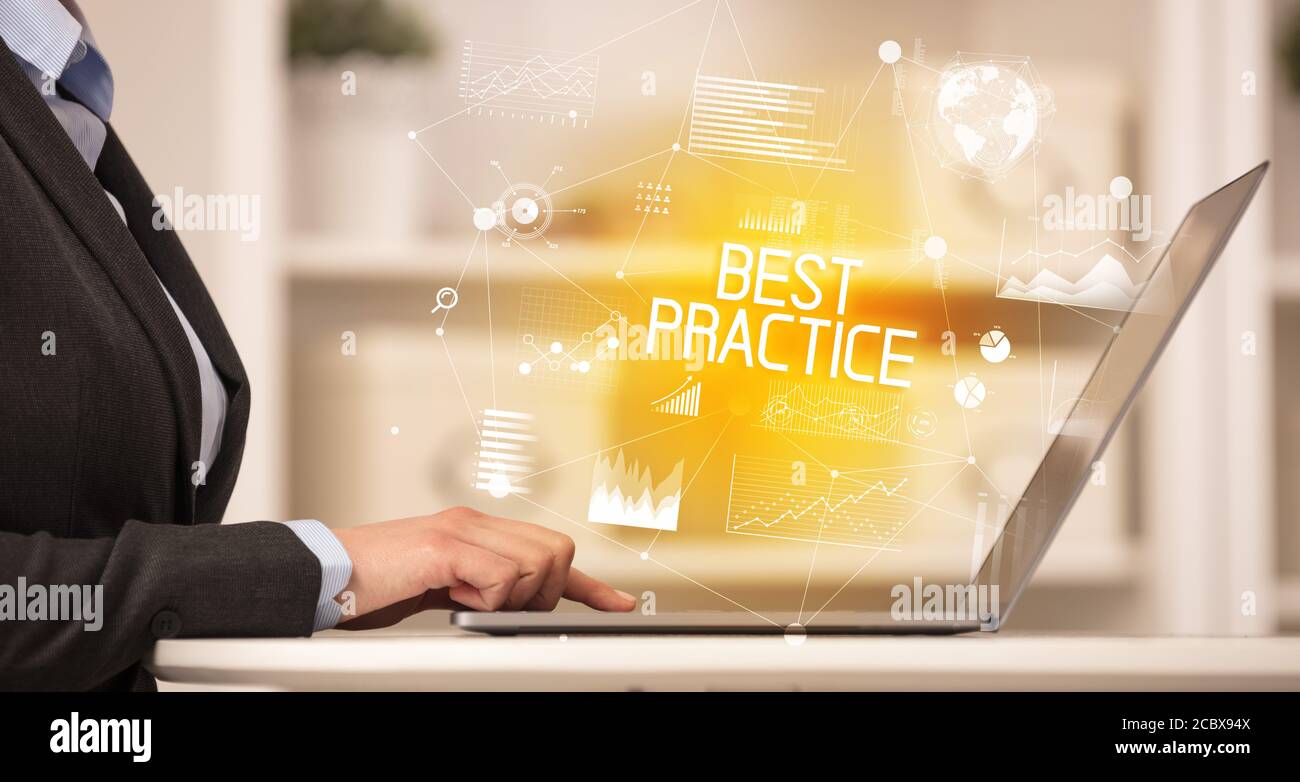 Side view of a business person working on laptop with BEST PRACTICE ...